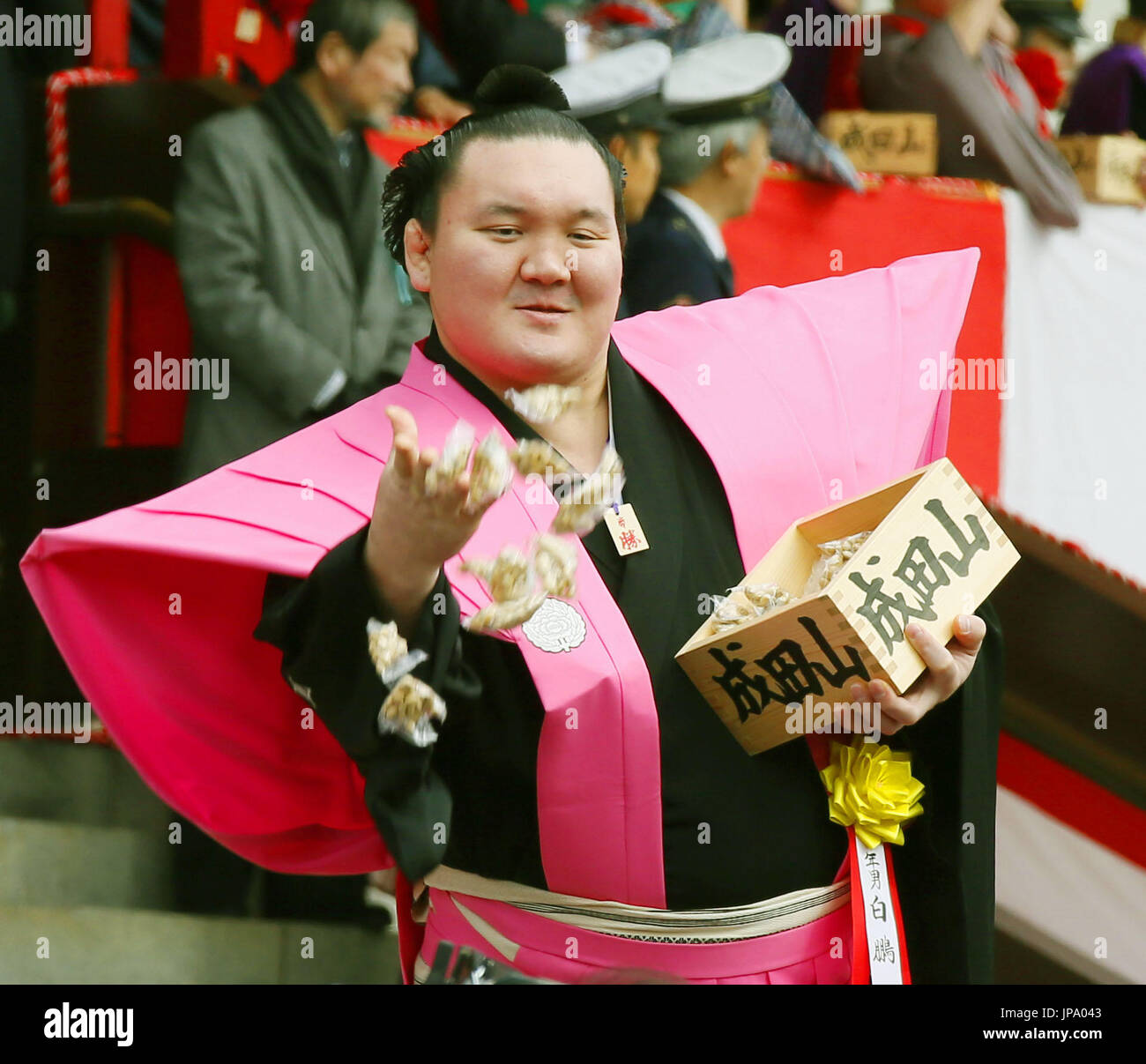 Sumo grand champion Hakuho scatters dried beans, a Japanese tradition ...
