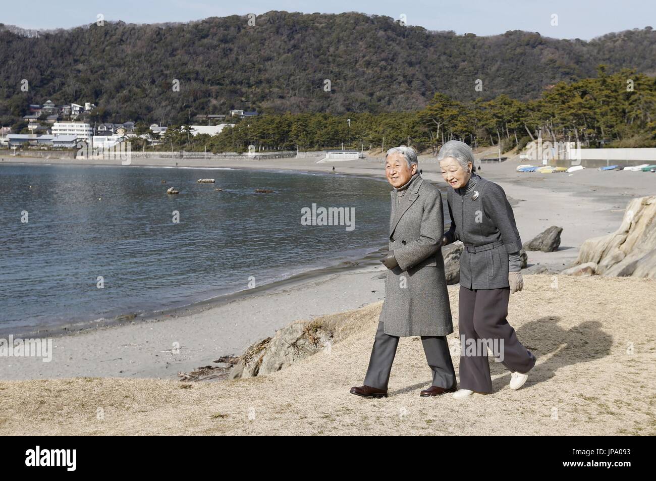 Japan's Emperor Akihito and Empress Michiko take a walk on a beach in ...