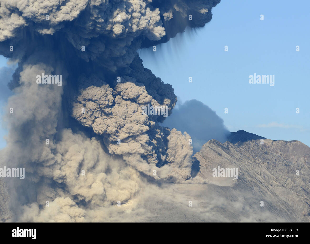An ash plume rises from the Sakurajima volcano in Kagoshima Prefecture ...