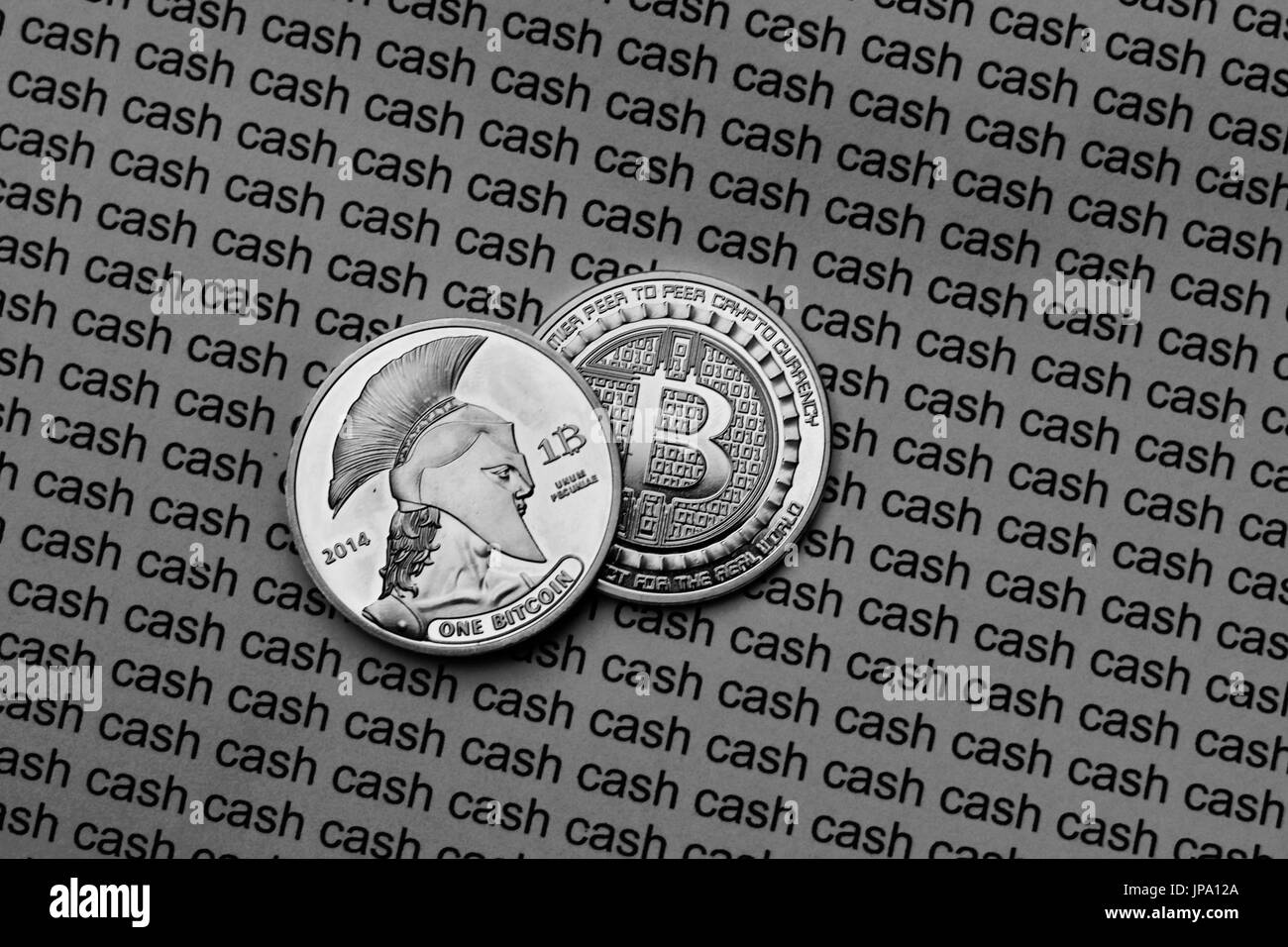 Digital currency physical metal bitcoin coin on the cash paper ...