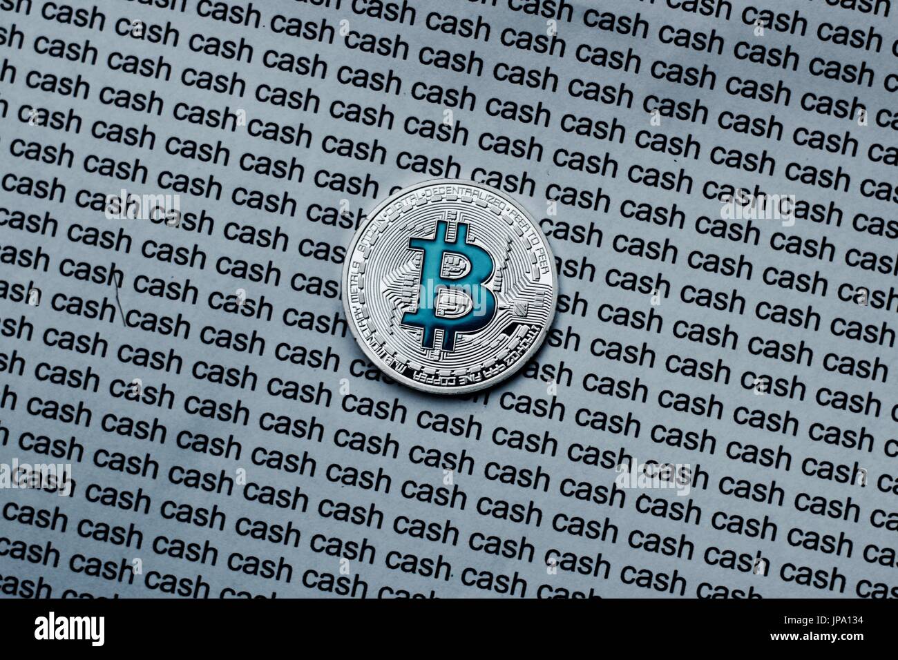 Digital currency physical metal bitcoin coin on the cash paper ...