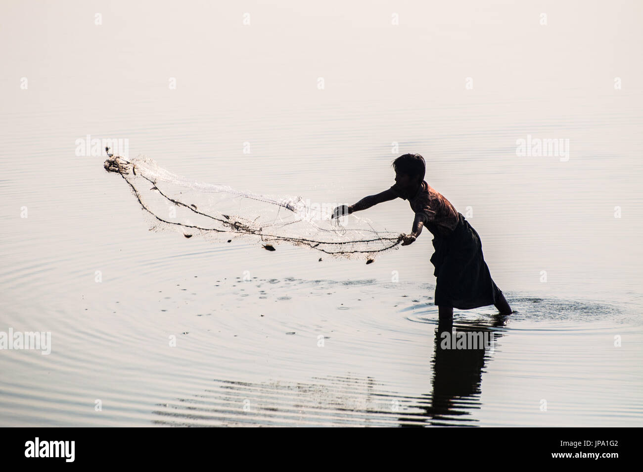 Catching fisher hi-res stock photography and images - Alamy