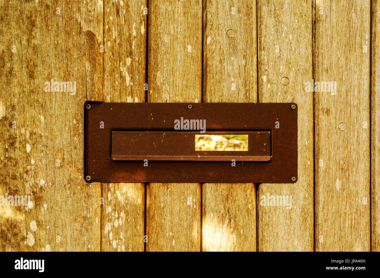 Old letterbox in the door, traditional way of delivering letters to the ...
