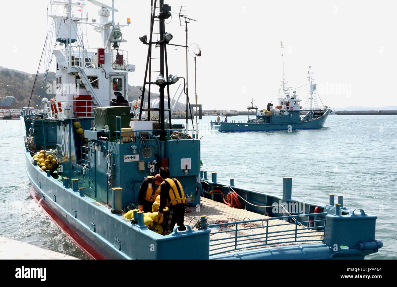 A fleet of whaling ships leaves Ayukawa port in the northeastern ...