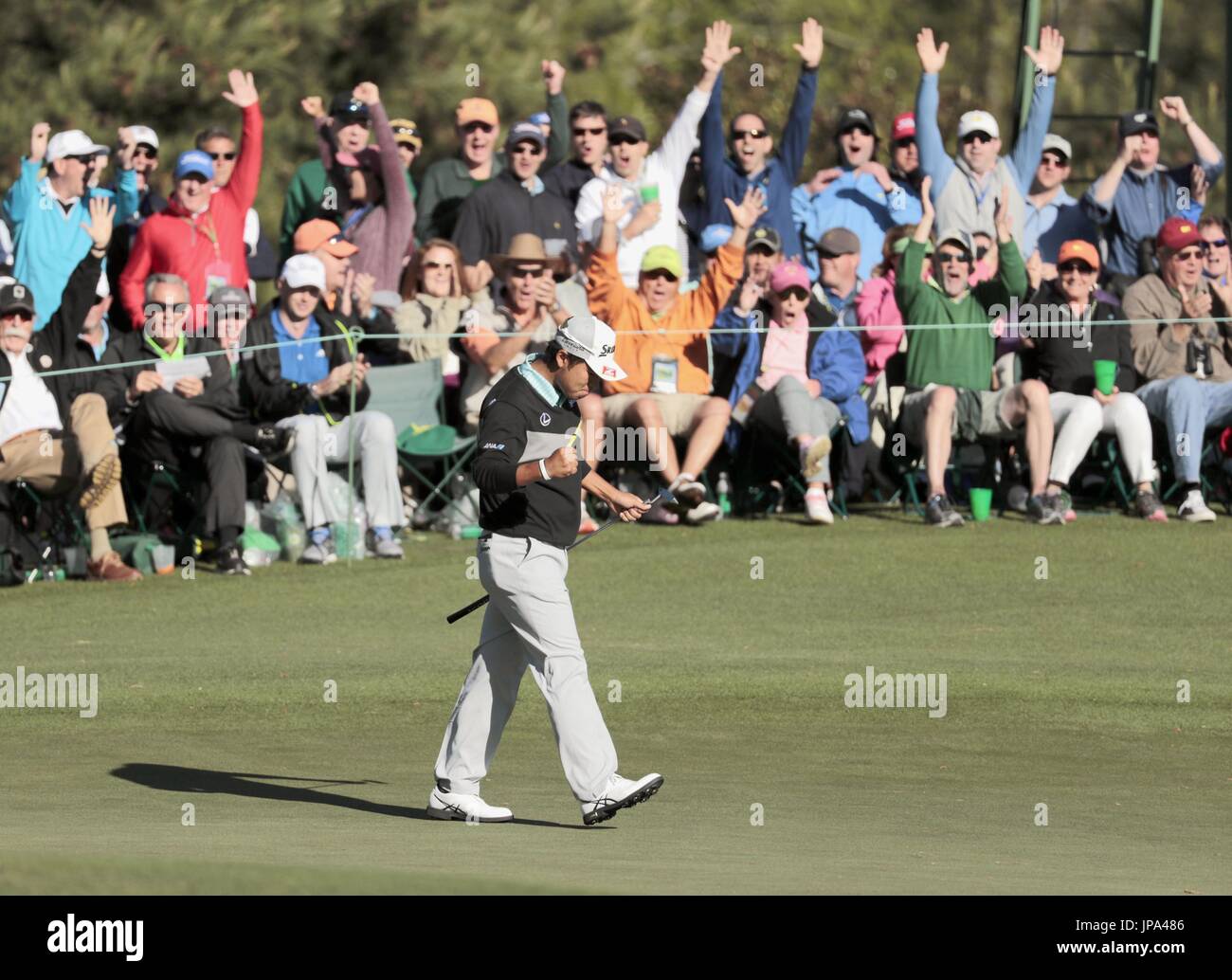 Japan's Hideki Matsuyama celebrates after a birdie putt on the 14th ...