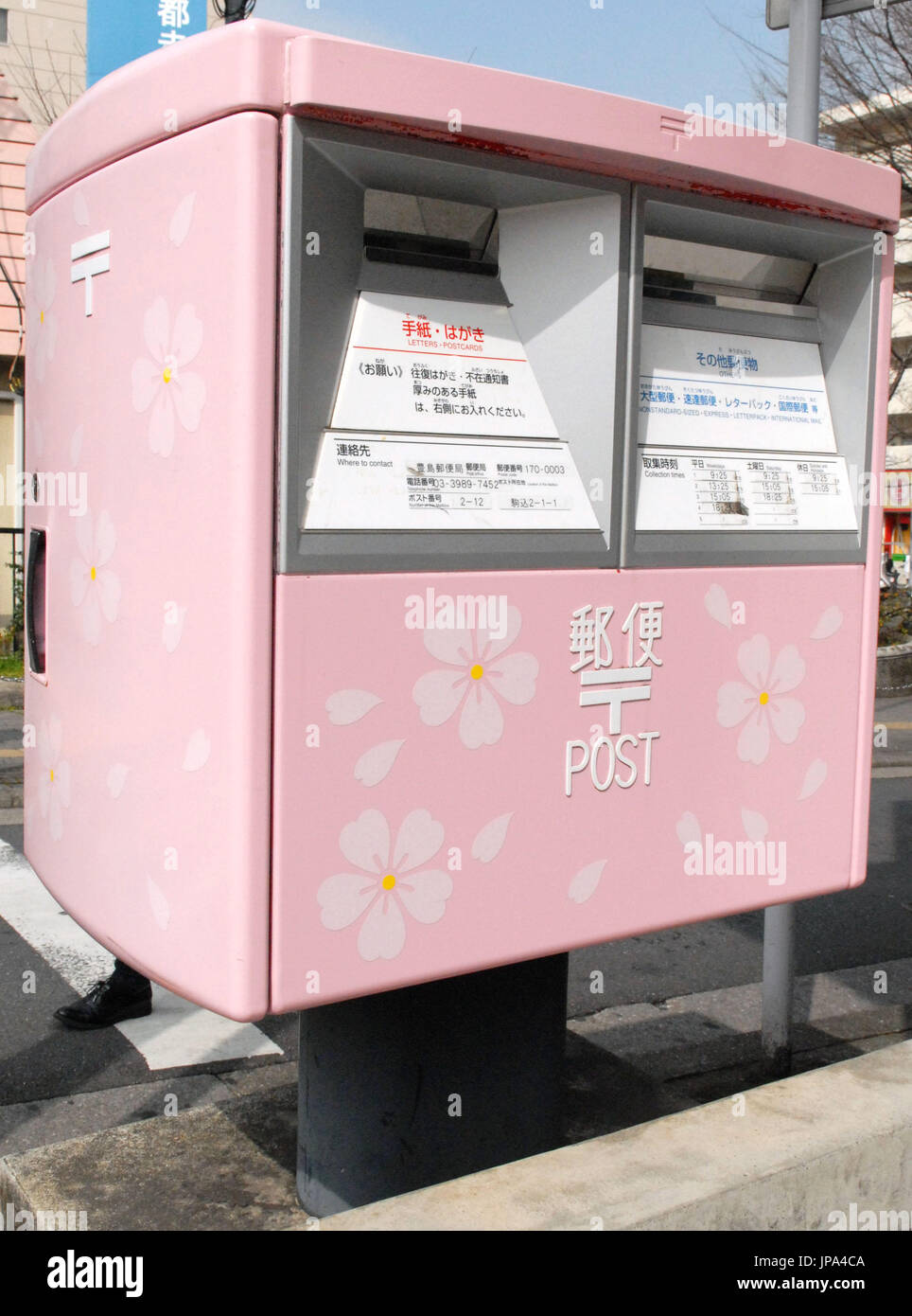 Photo taken March 8, 2016, shows a pale pink-colored mailbox with a ...