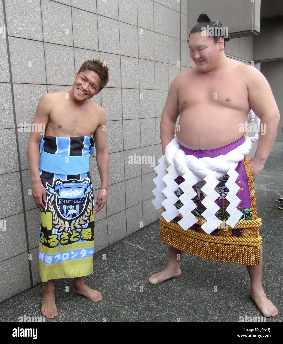 Kawasaki Frontale forward Yoshito Okubo (L) smiles wearing a sumo ...