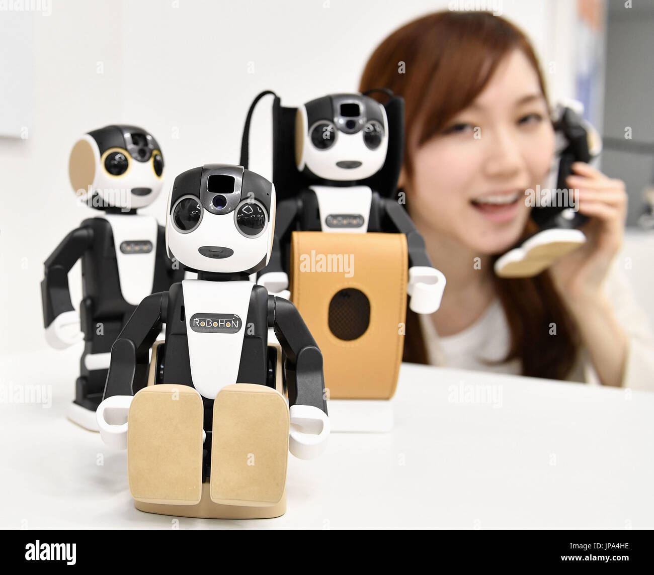 Sharp Corp.'s RoBoHoN humanoid robot-shaped mobile phones are displayed ...