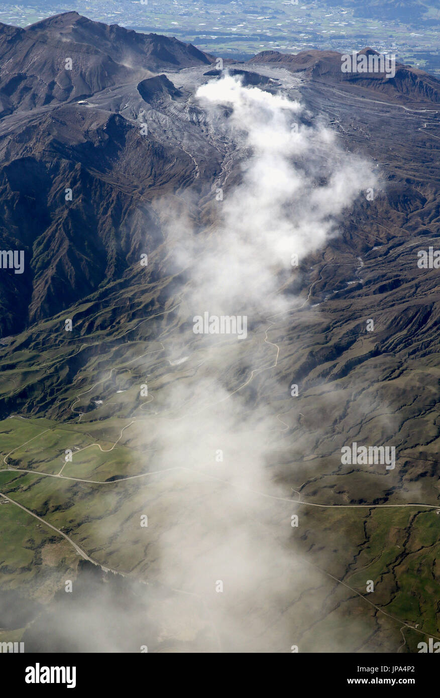 Photo taken from a Kyodo News airplane shows smoke billowing from Mt ...