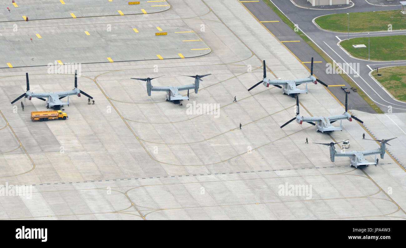 U.S. Osprey tilt-rotor aircraft wait for takeoff at the Iwakuni Air ...