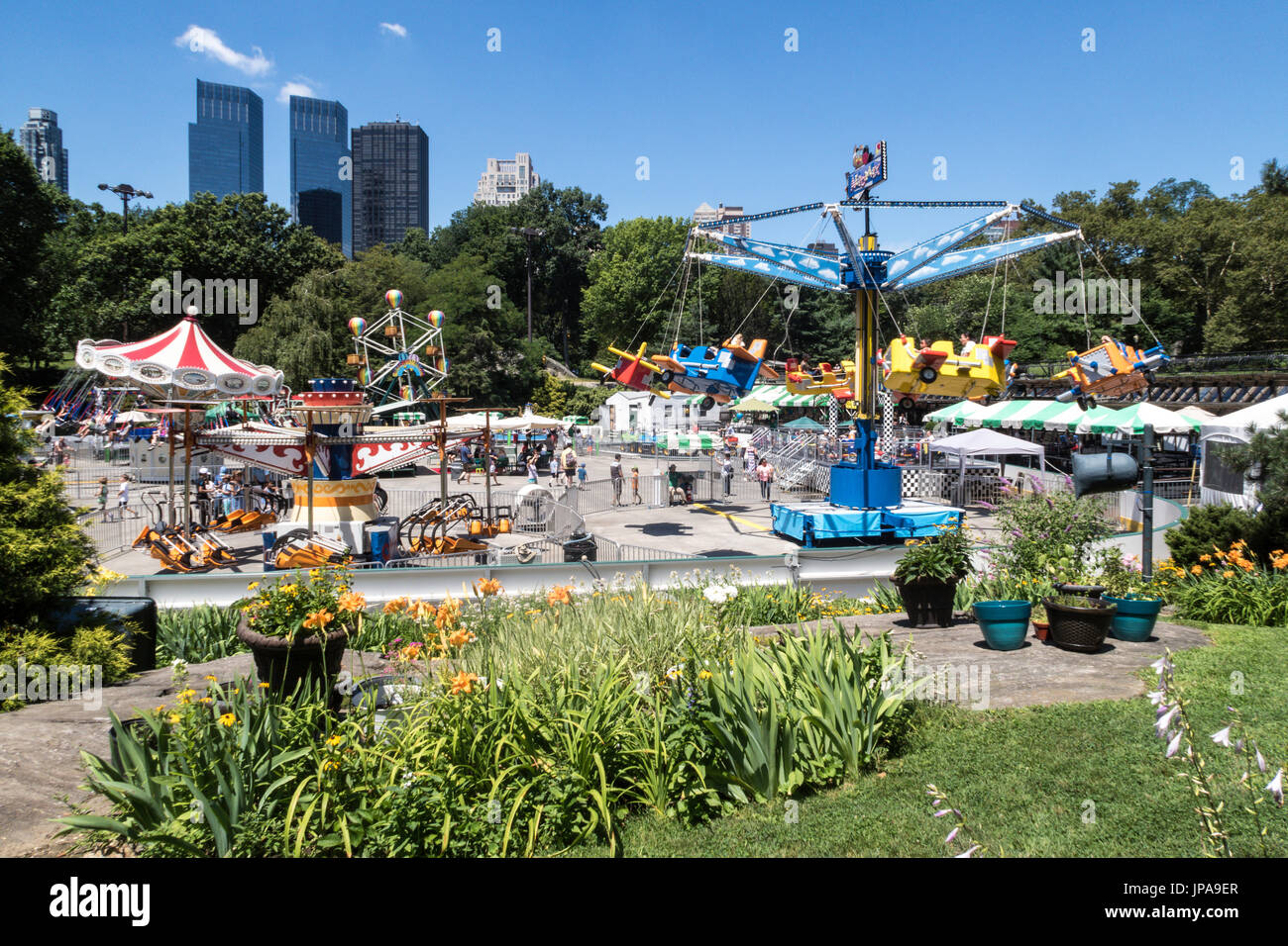 Victorian Gardens, Carnival Rides in Central Park with the Manhattan ...