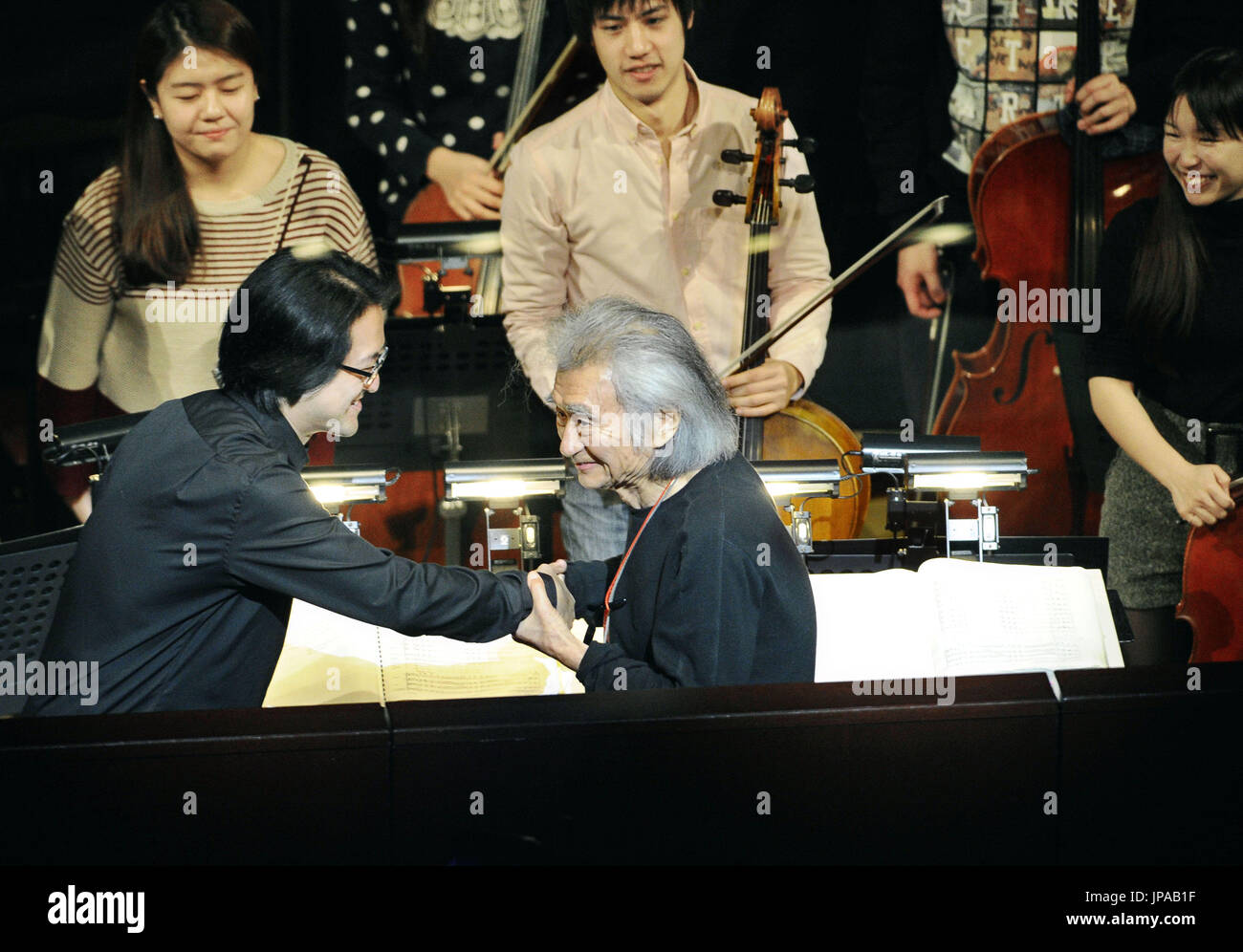 Japanese conductor Seiji Ozawa (C front) is congratulated in Kyoto on ...