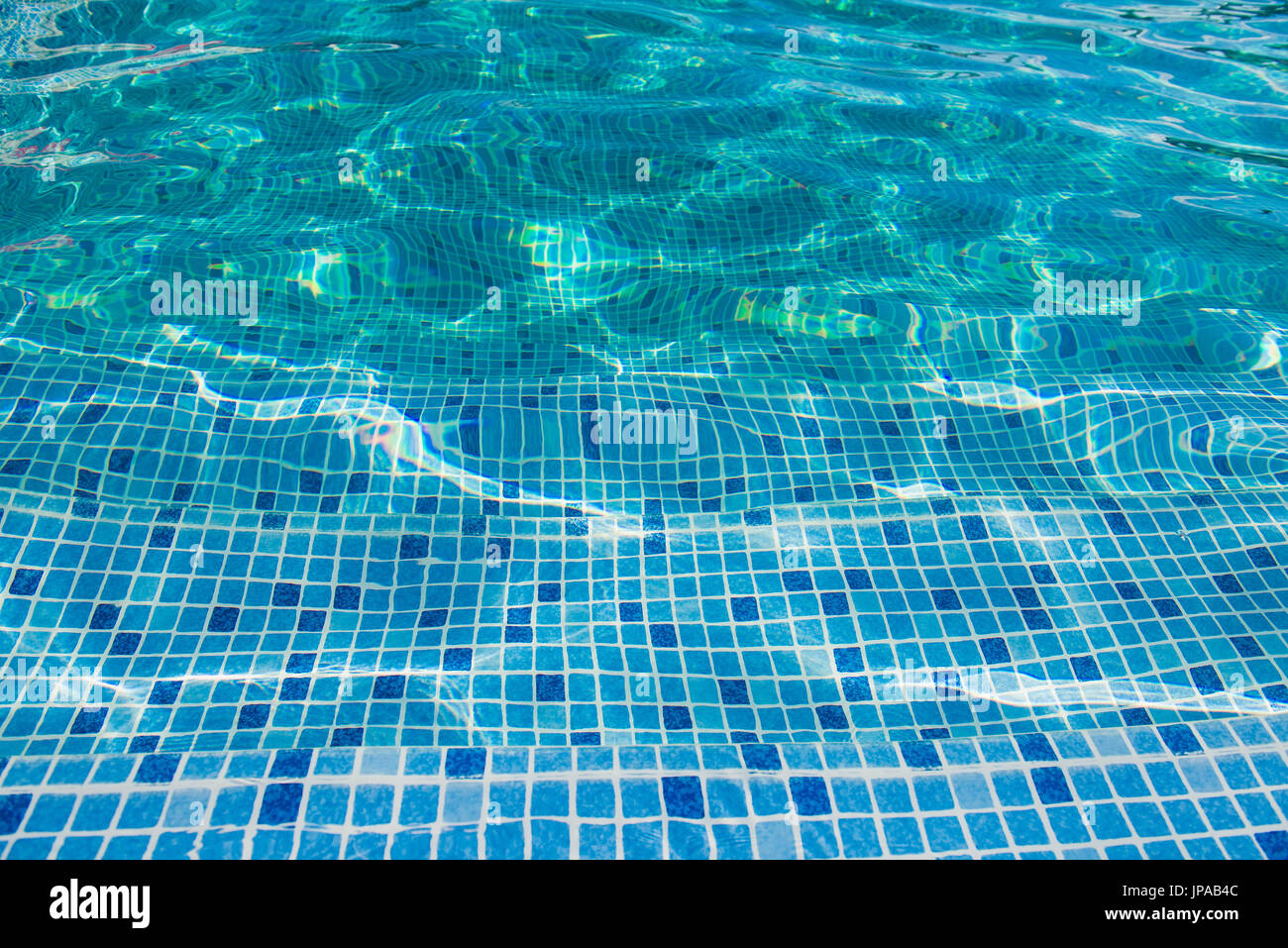 Beautiful pattern of blue water reflecting the sun. Water ripples in ...