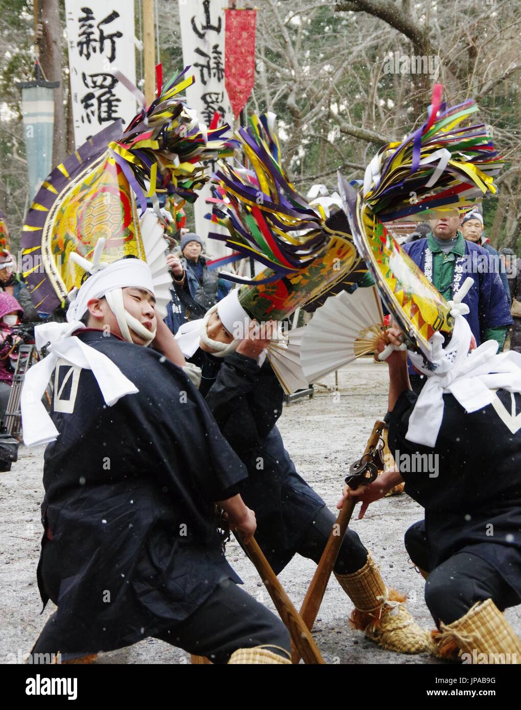 People wearing elaborate "eboshi" hats in the shape of horses' heads ...