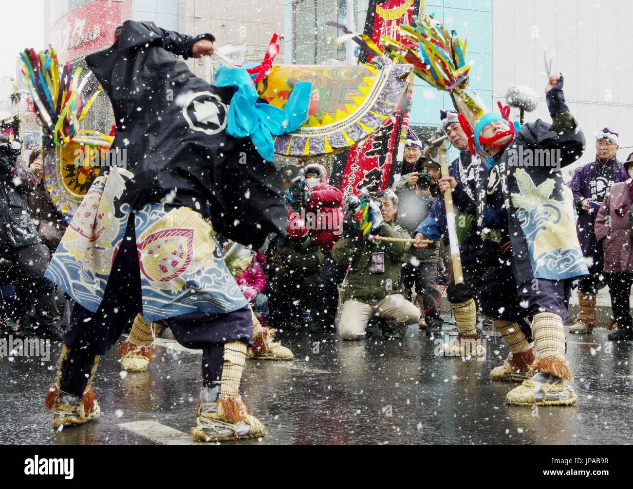 People wearing elaborate "eboshi" hats in the shape of horses' heads ...