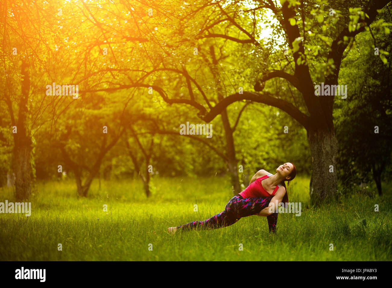 Girl doing extended side angle with grip behind back yoga pose Stock ...