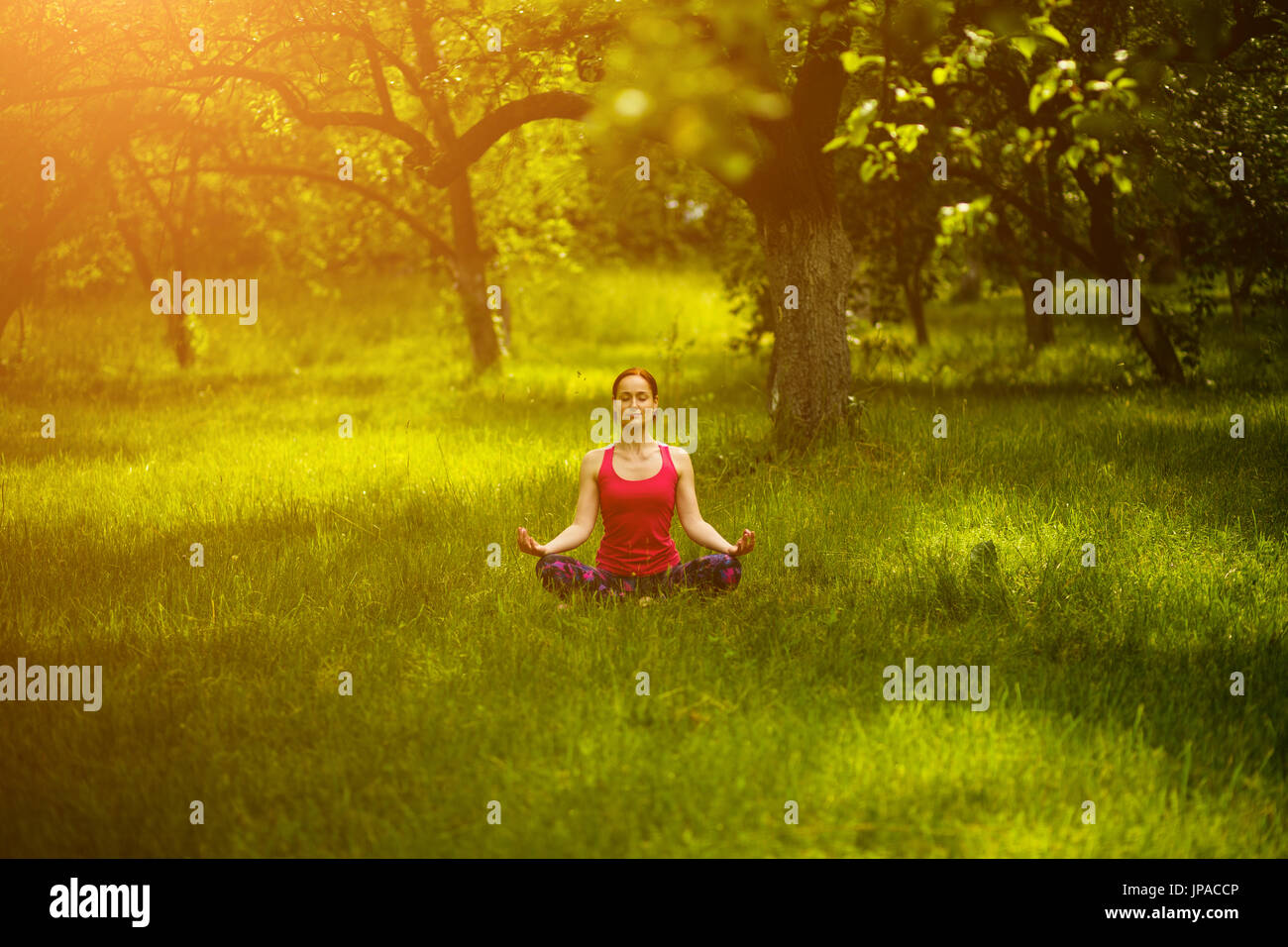 Woman relaxing in yoga pose Sukhasana Stock Photo - Alamy