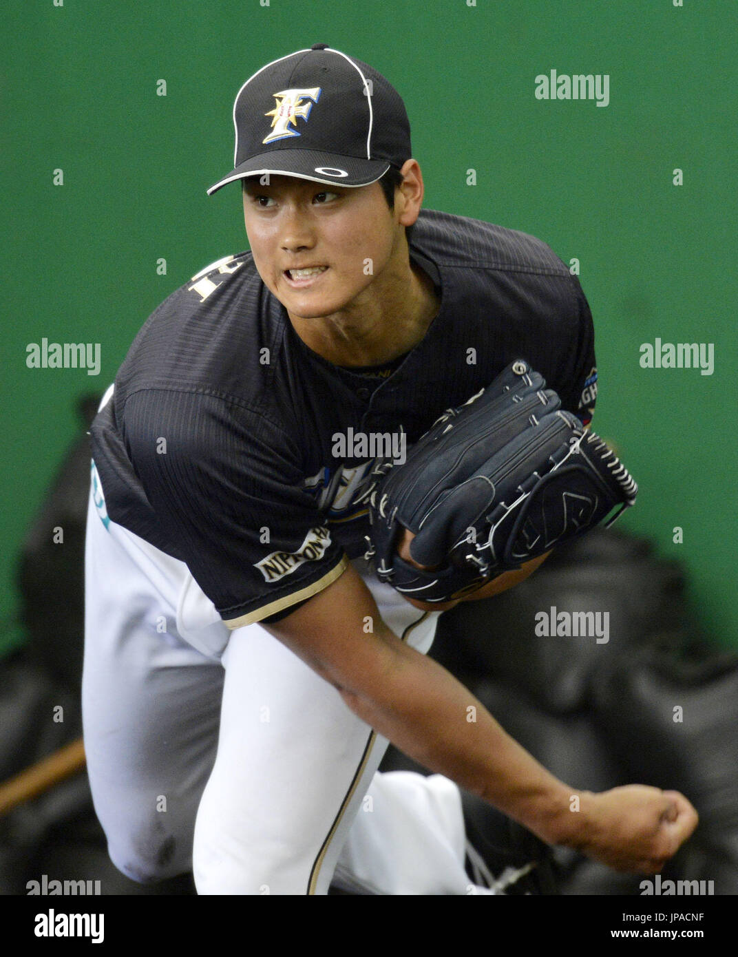 Shohei Otani of the Nippon Ham Fighters throws a pitch during the club ...
