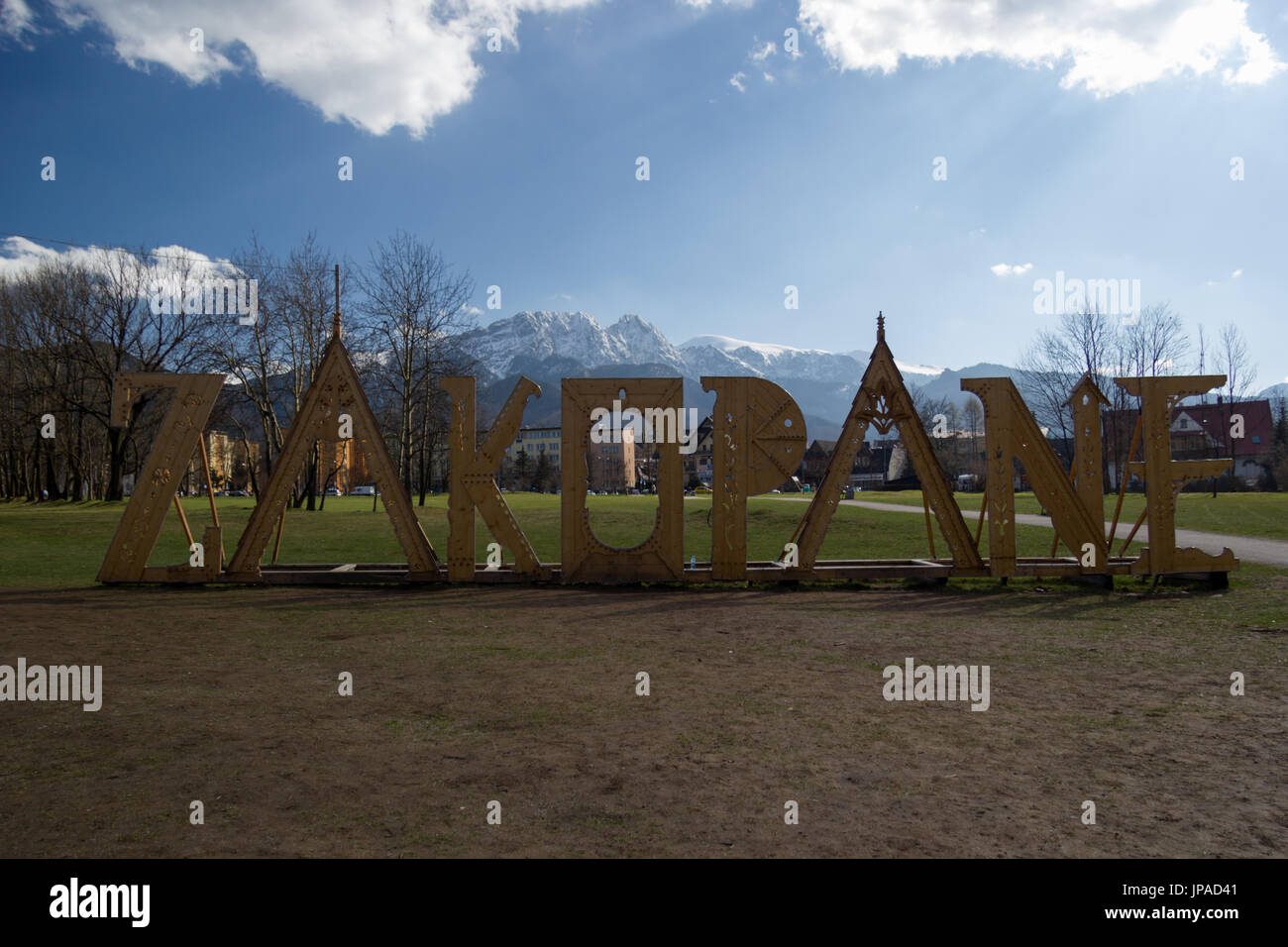 Zakopane sign with mountains in background Stock Photo - Alamy