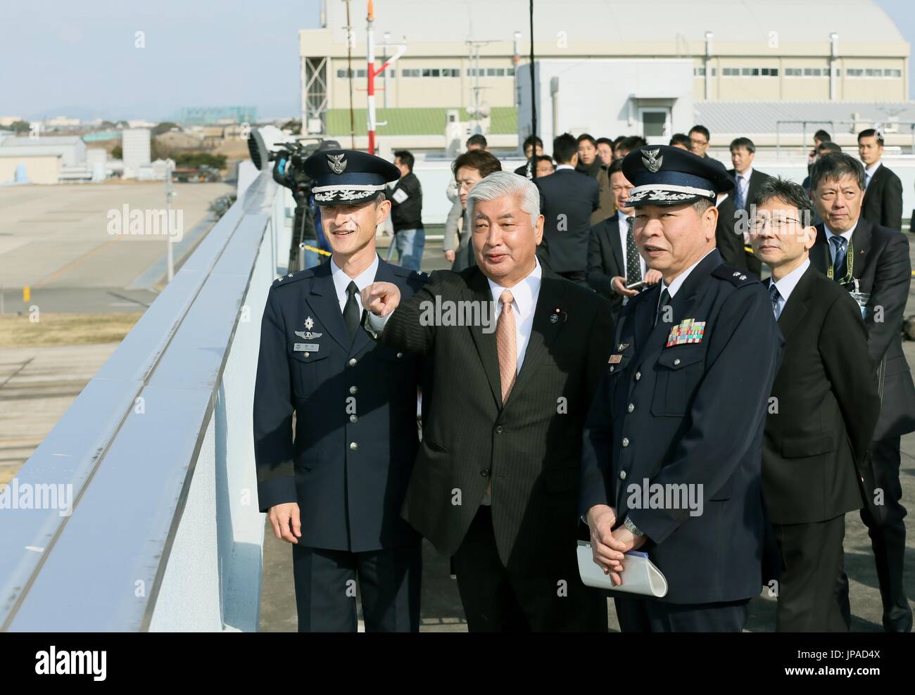 Japanese Defense Minister Gen Nakatani (2nd from L) views a ground test ...