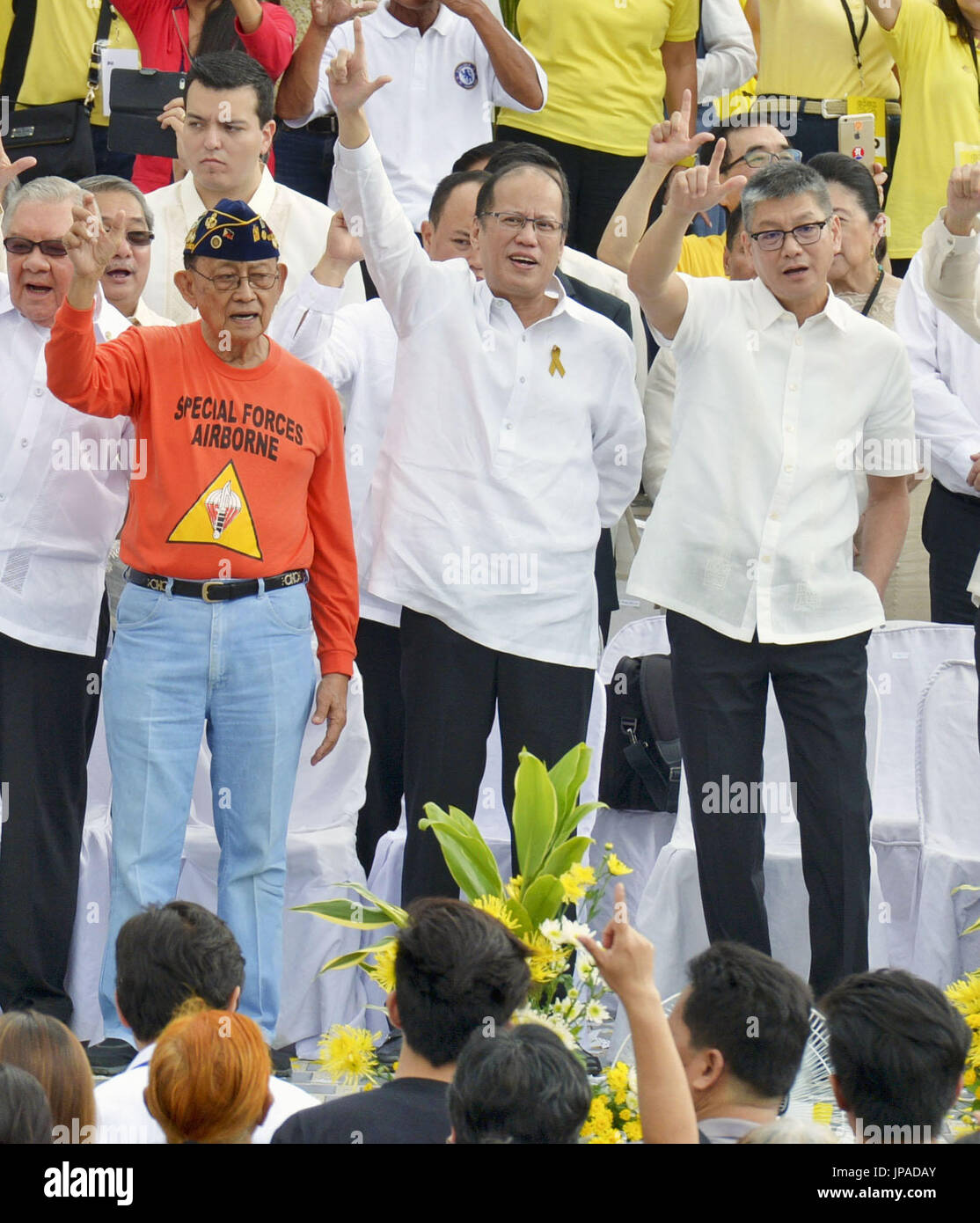 Philippine President Benigno Aquino (C) and former President Fidel V ...
