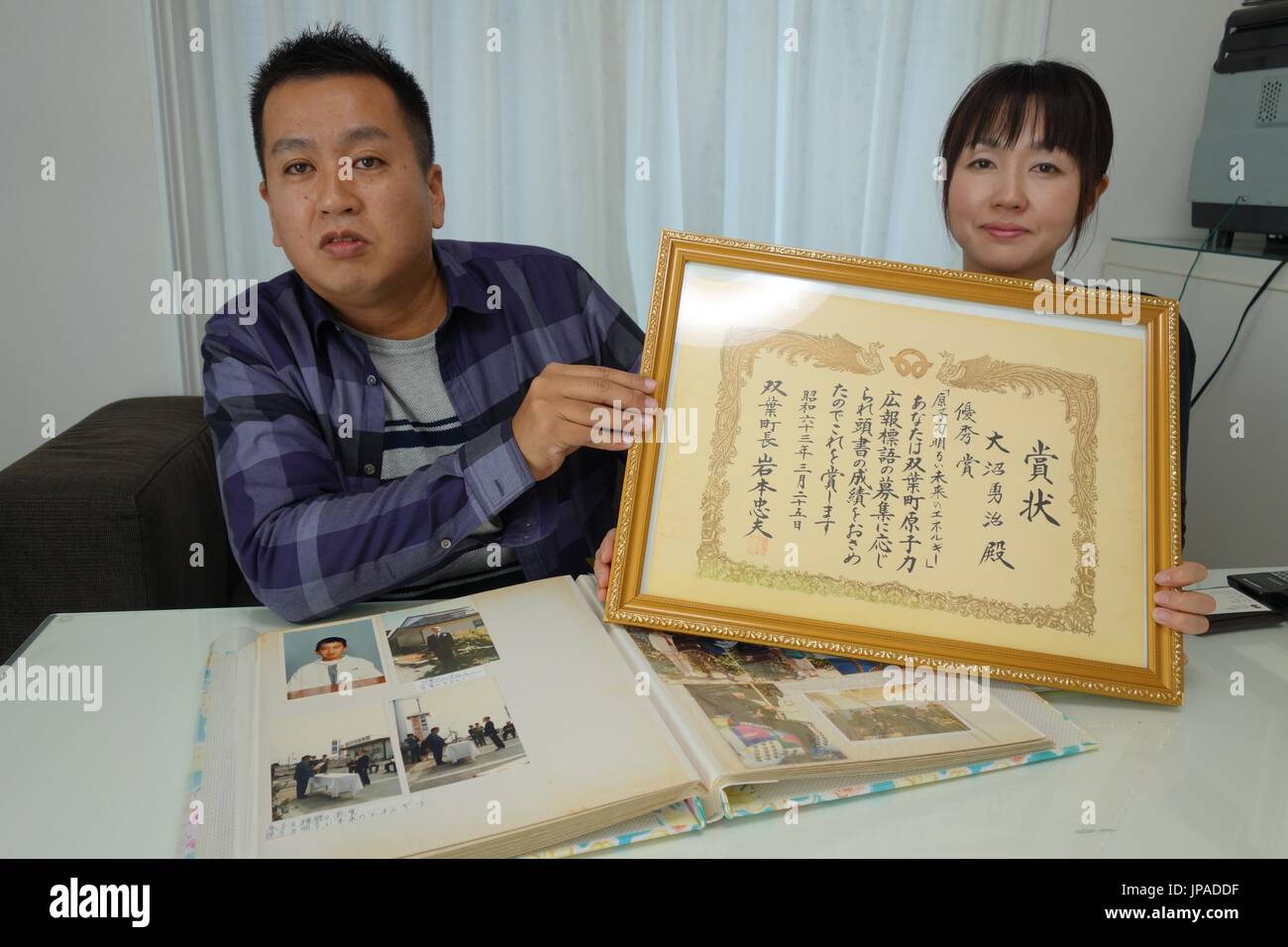 Yuji Onuma (L), 39, and his wife Serina, 40, at their home in Koga ...
