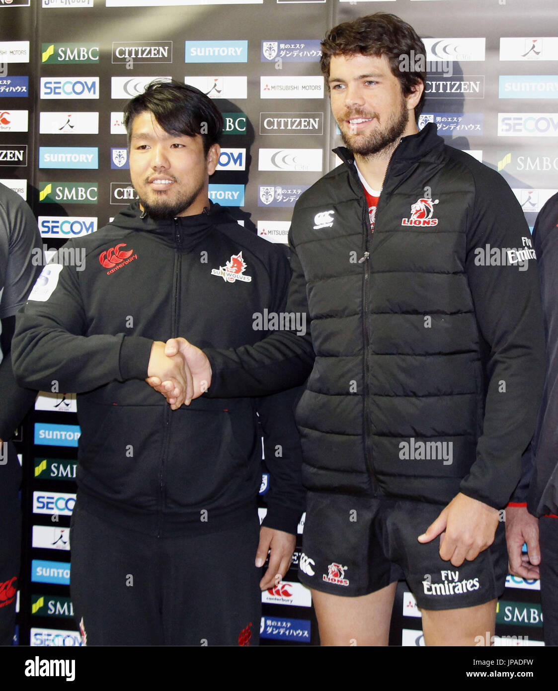 Sunwolves captain Shota Horie (L) and Lions captain Warren Whiteley ...
