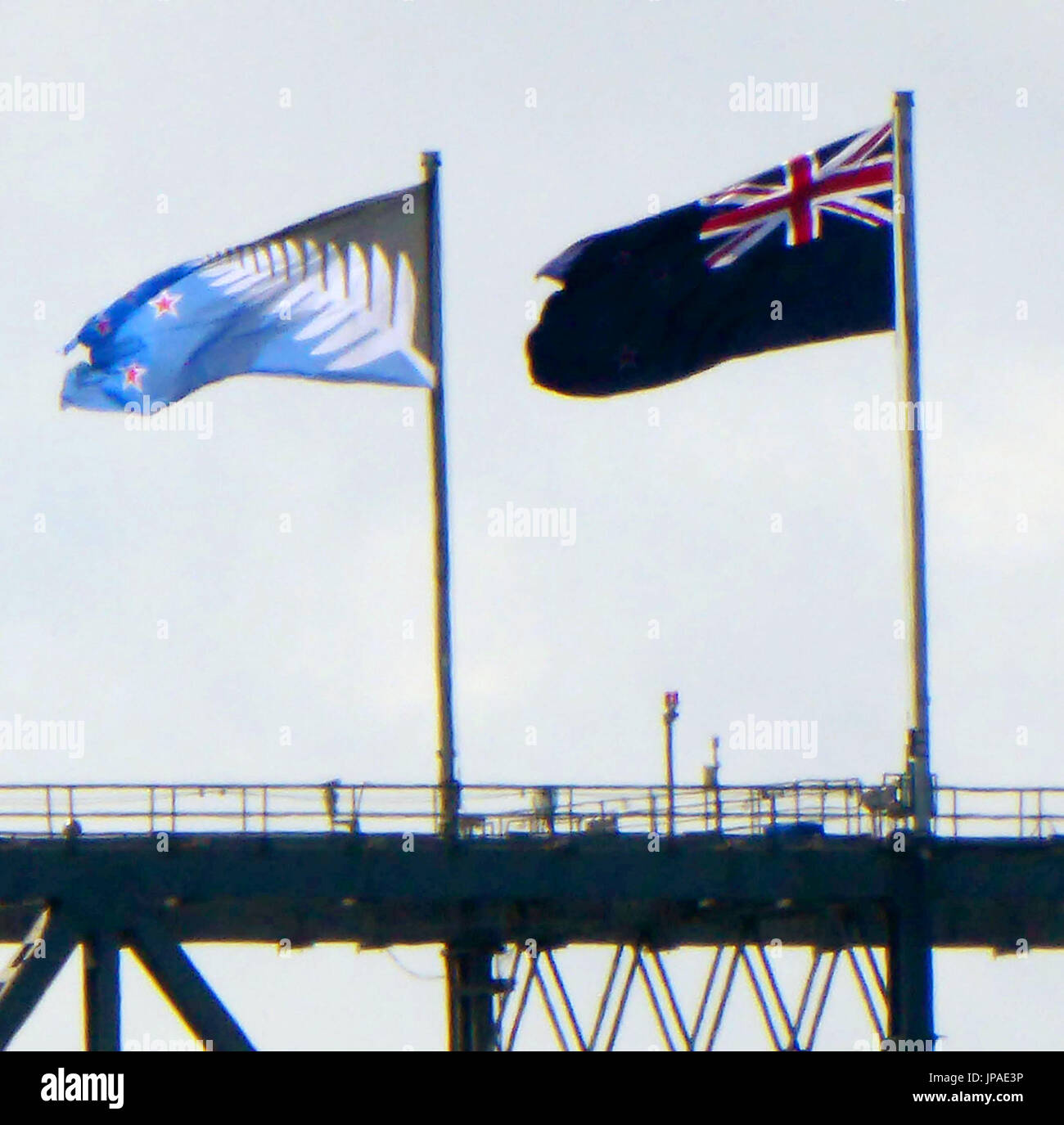 Photo taken in February 2016 shows the current New Zealand flag (R) and ...