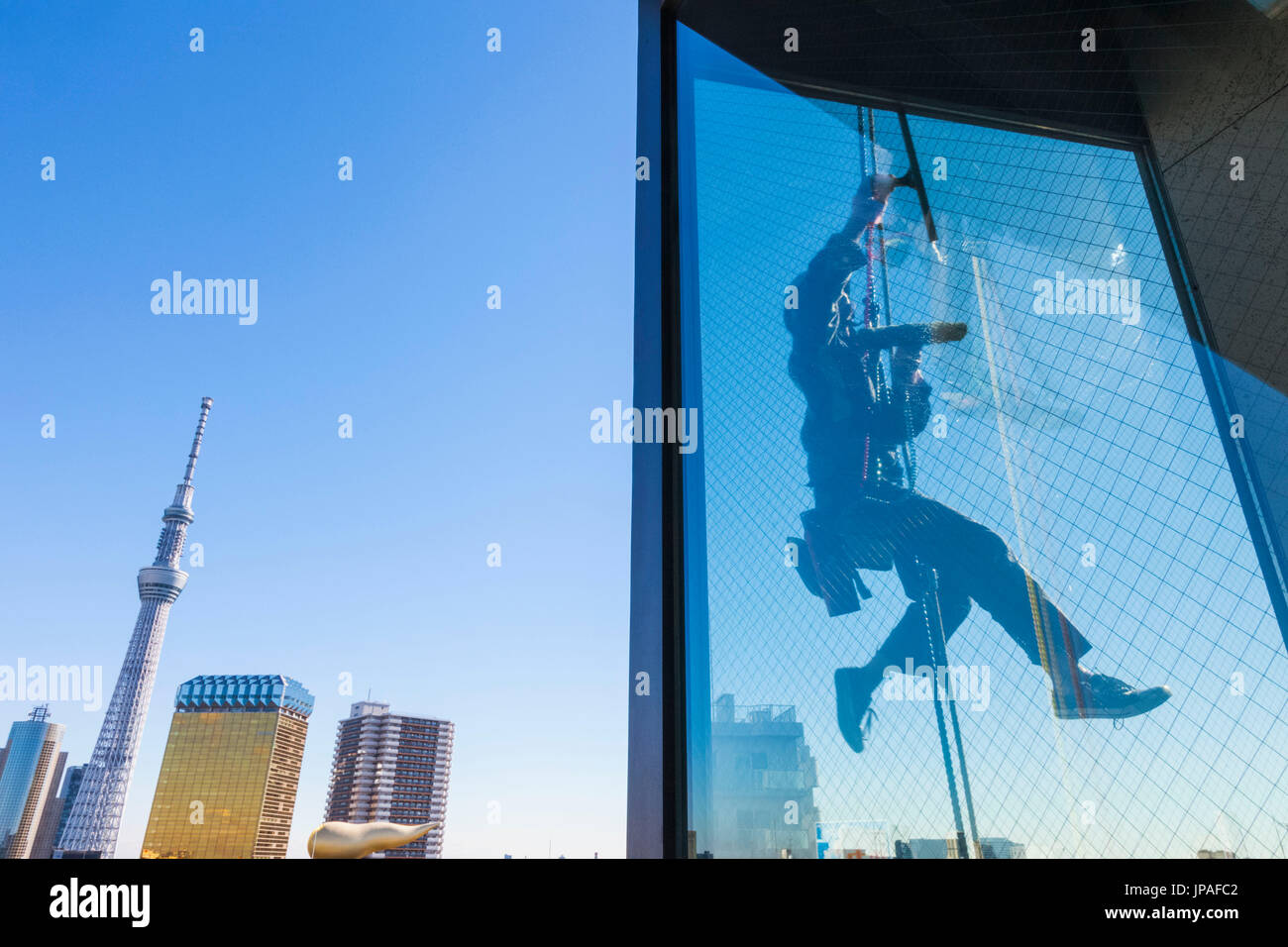 Japan, Honshu, Tokyo, Asakusa, Tokyo Sky Tree and Window Cleaner Stock ...