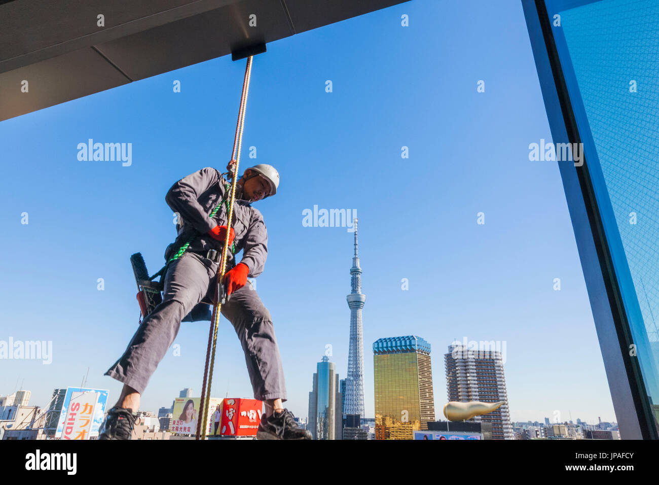 Japan, Honshu, Tokyo, Asakusa, Tokyo Sky Tree and Window Cleaner Stock ...