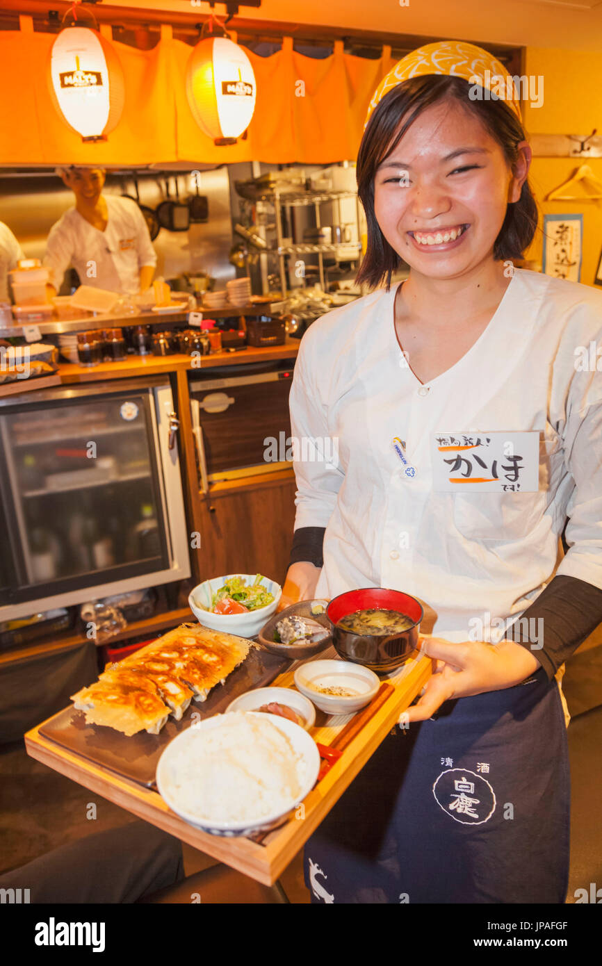 Japan, Honshu, Tokyo, Restaurant Waiteress Serving Food Stock Photo - Alamy