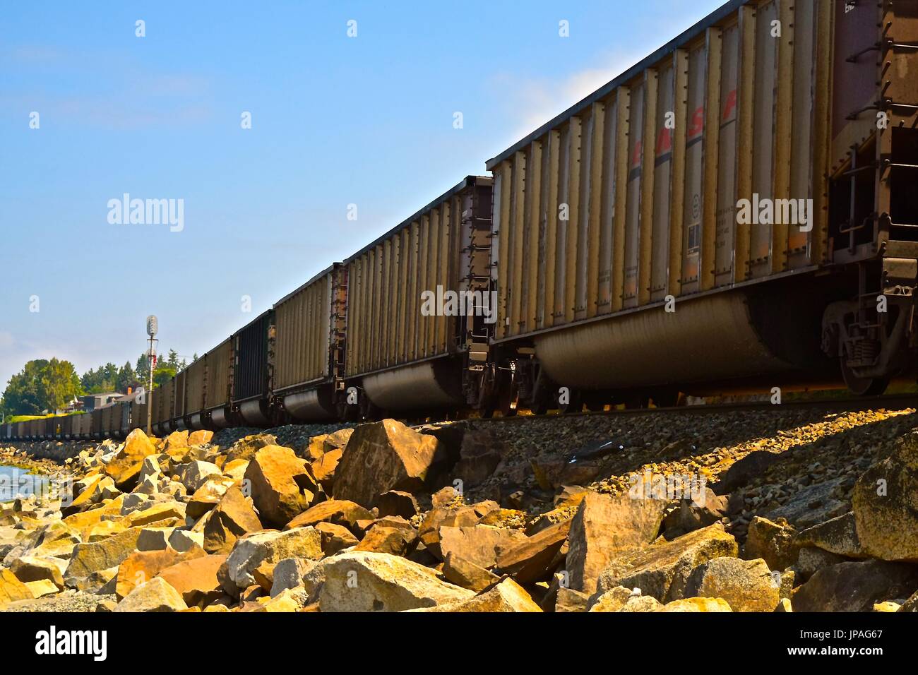 Freight train hauling and rumbling towards Seattle Stock Photo - Alamy