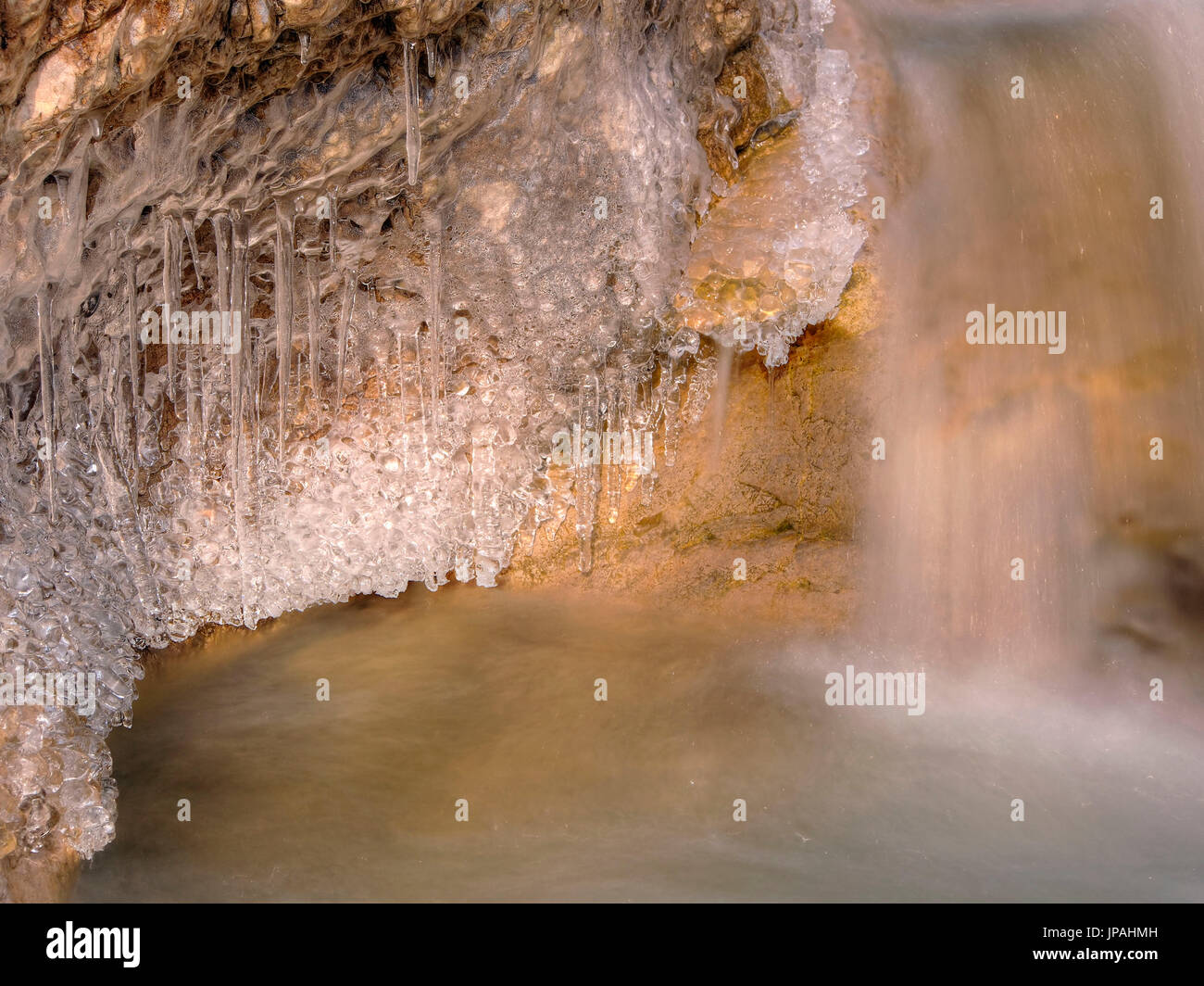 Iced up stream course Stock Photo - Alamy