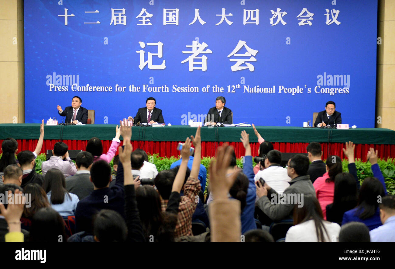 Chinese Finance Minister Lou Jiwei (2nd from L) attends a press ...