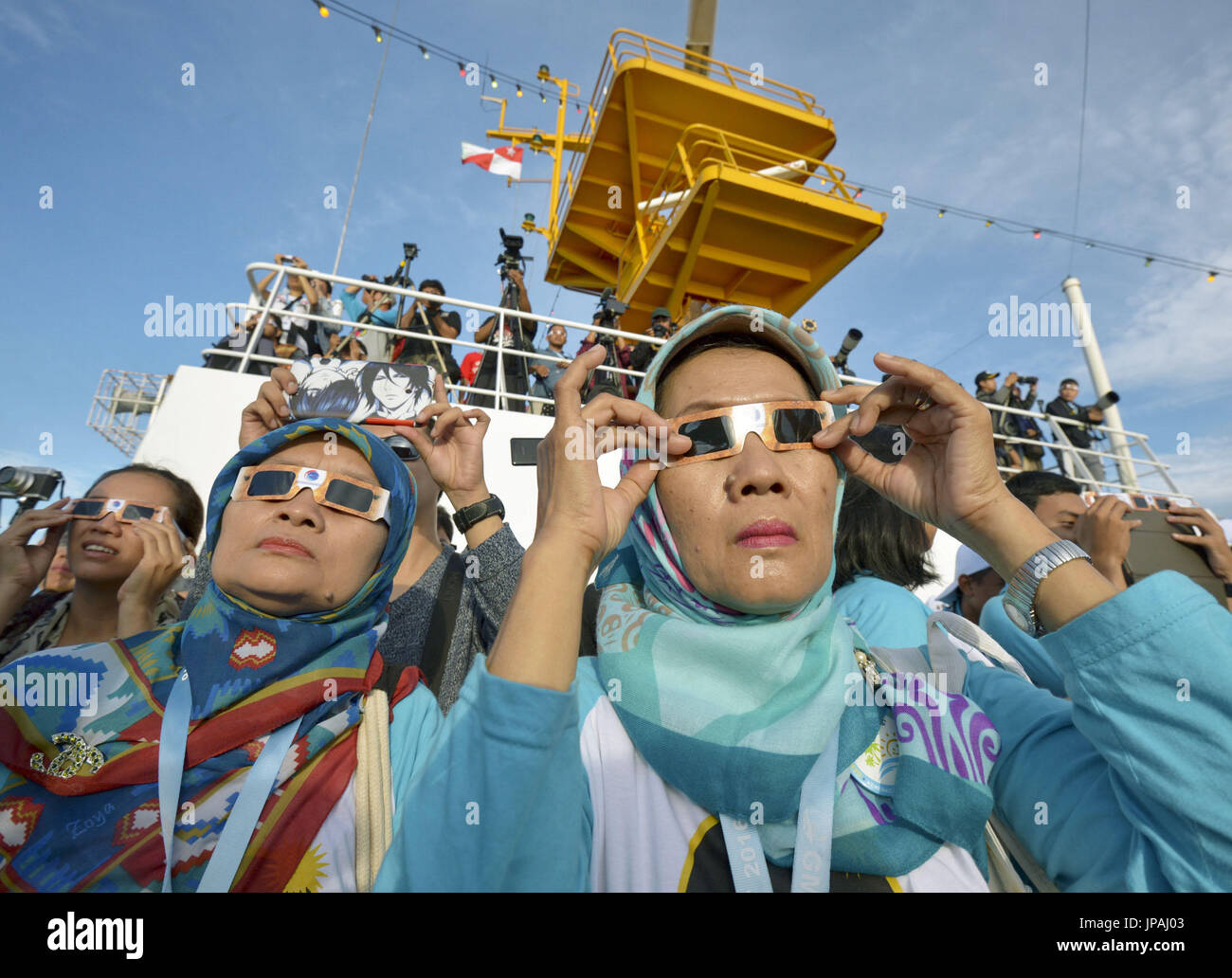 Passengers With Protective Glasses Observe A Total Solar Eclipse On 4448