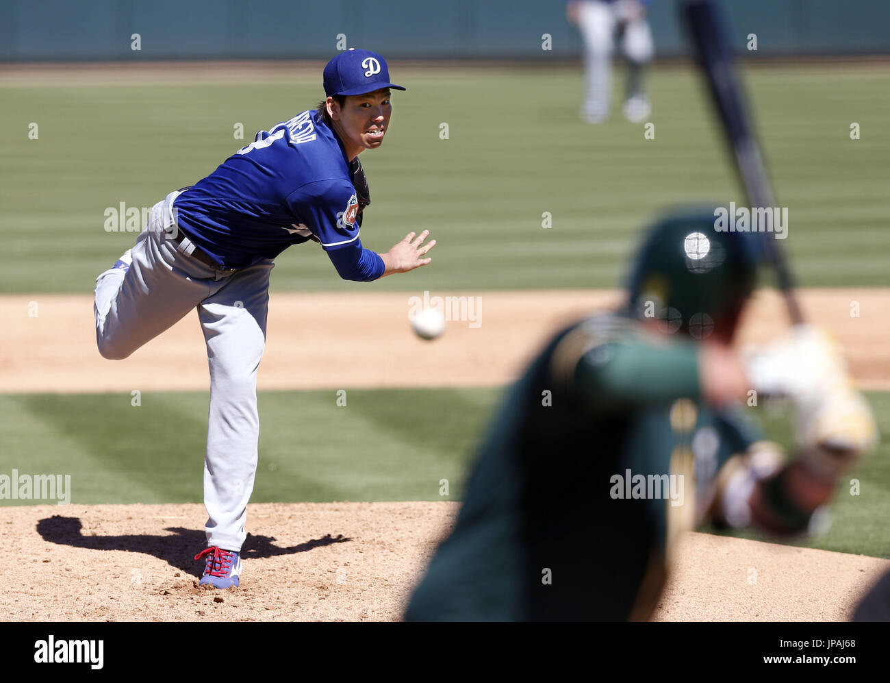 Los Angeles Dodgers pitcher Kenta Maeda starts a spring training game ...