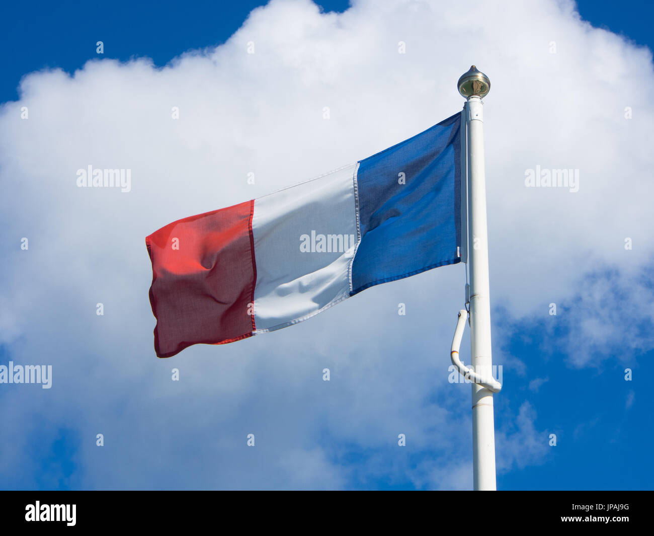 The French national flag flying from a flagpole Stock Photo - Alamy