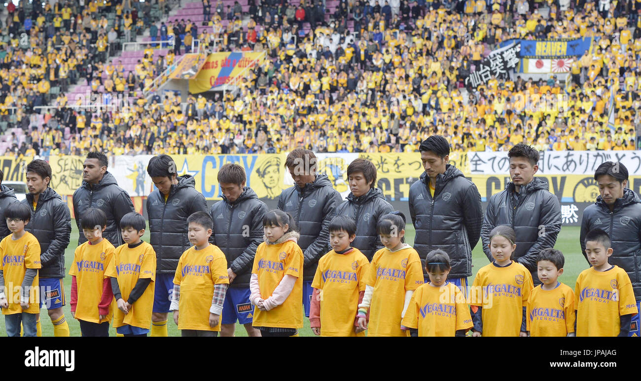 Vegalta Sendai players observe a moment of silence before a J-League ...