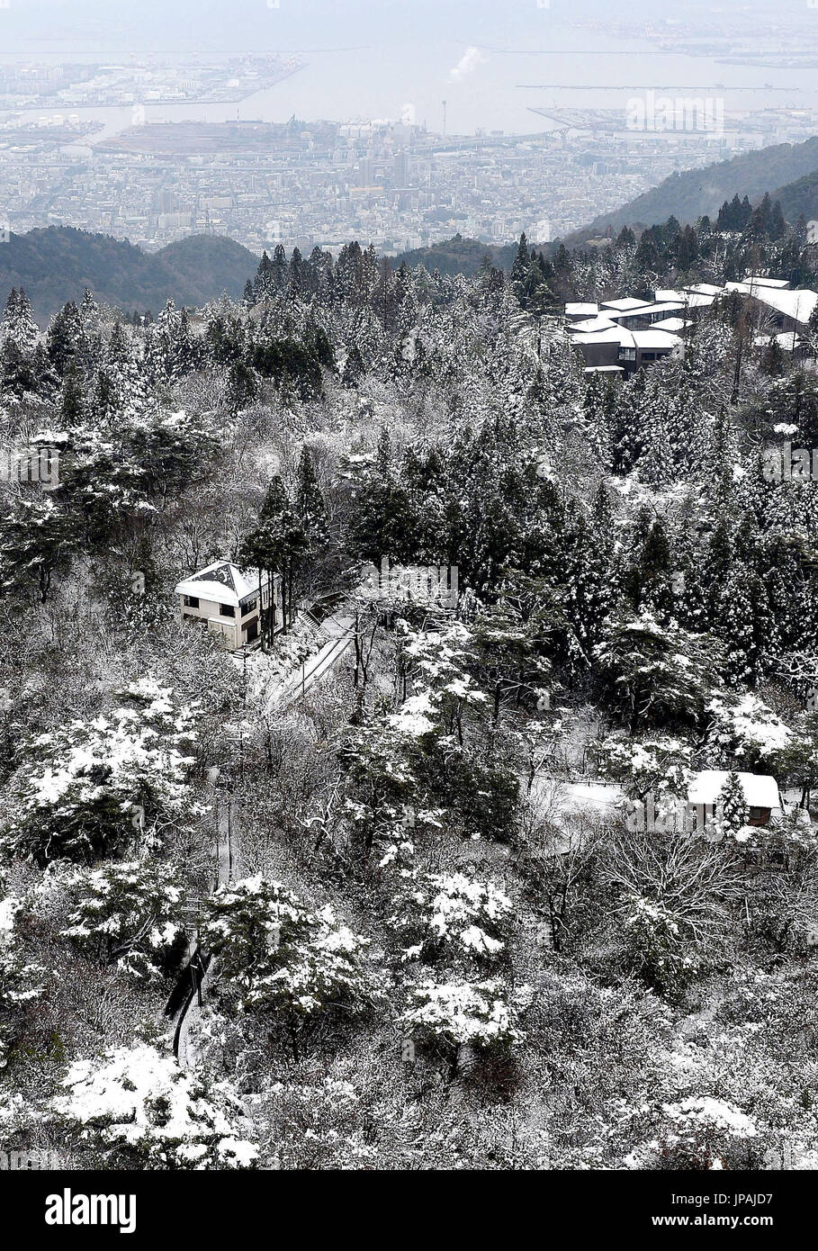 Photo taken from a Kyodo News helicopter shows a snow-covered Mt. Rokko ...