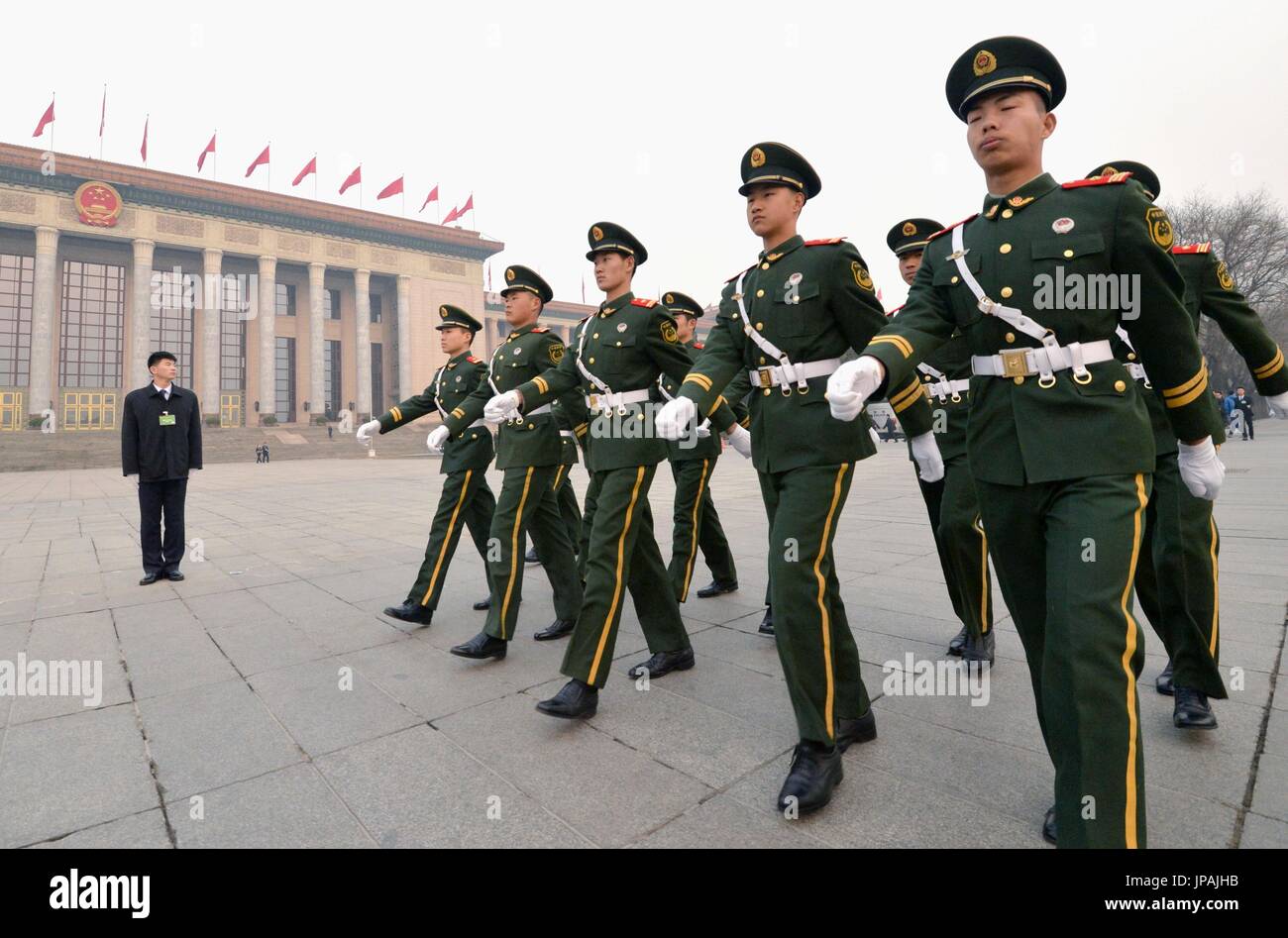 Armed police officers keep guard in front of the Great Hall of the ...
