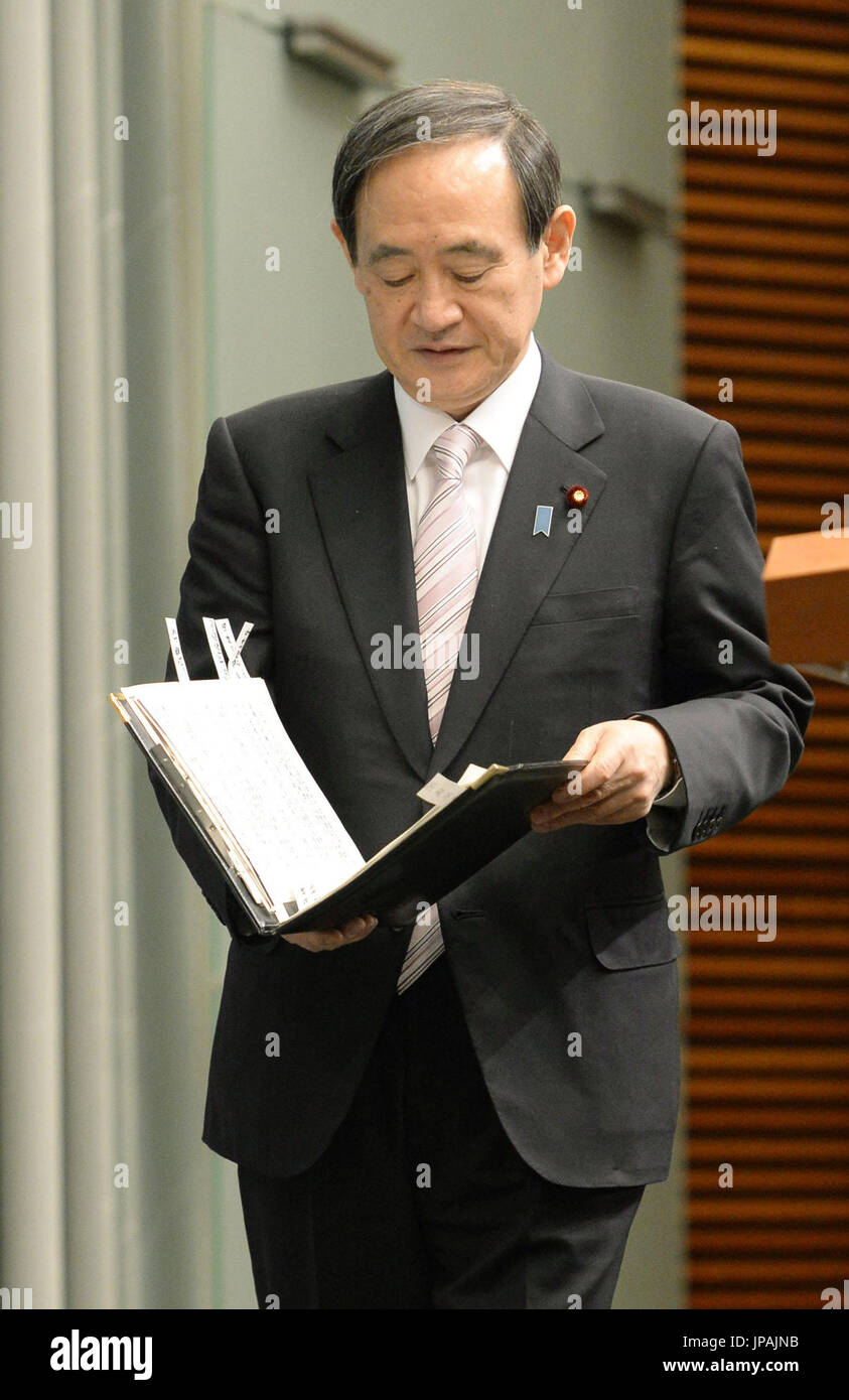 Chief Cabinet Secretary Yoshihide Suga gets ready for a press ...