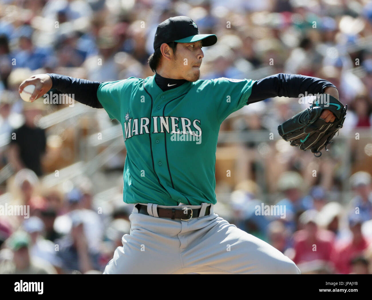 Hisashi Iwakuma of the Seattle Mariners gives up three runs and eight ...