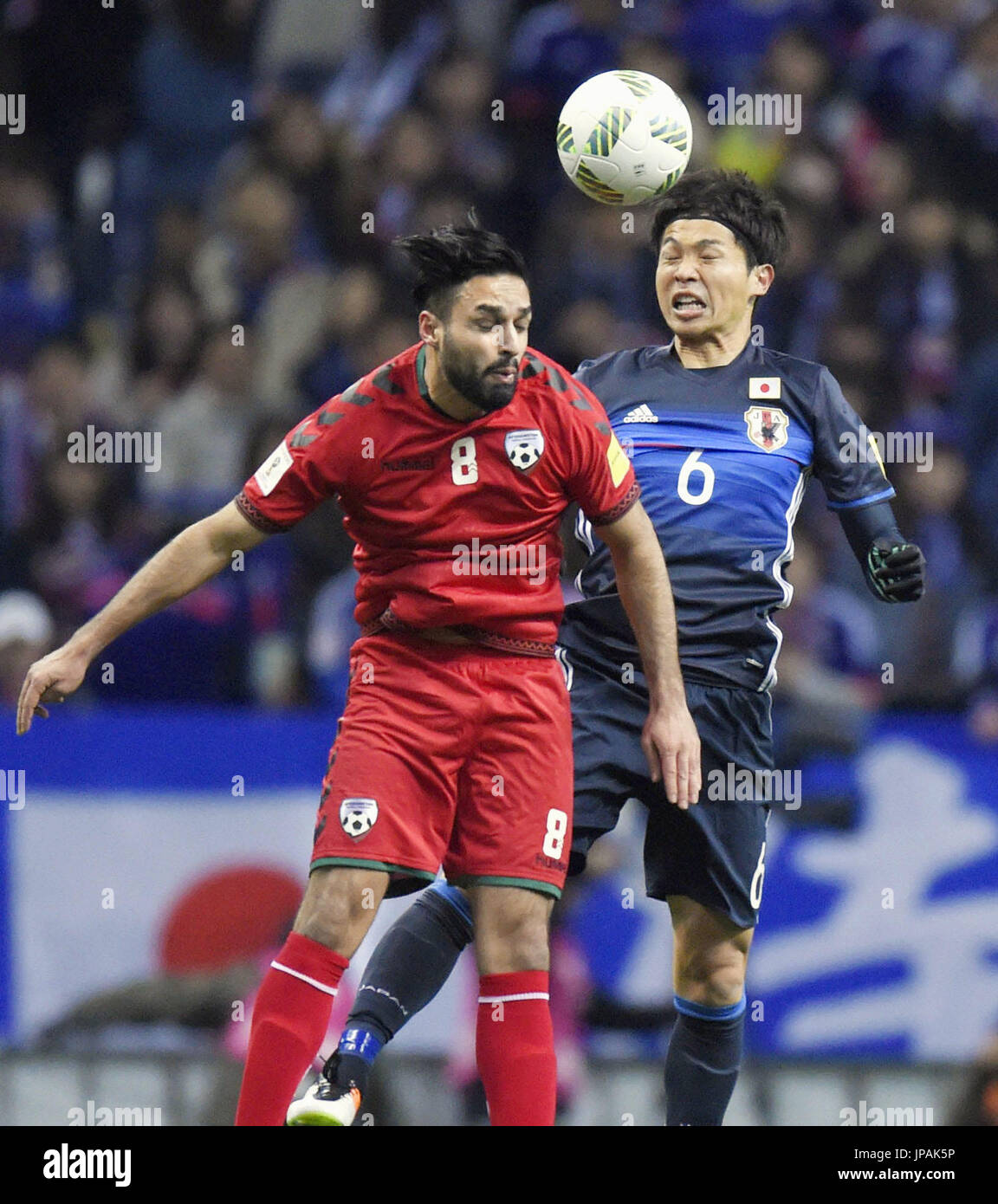 Japan defender Masato Morishige (R) and Afghanistan forward Faisal ...