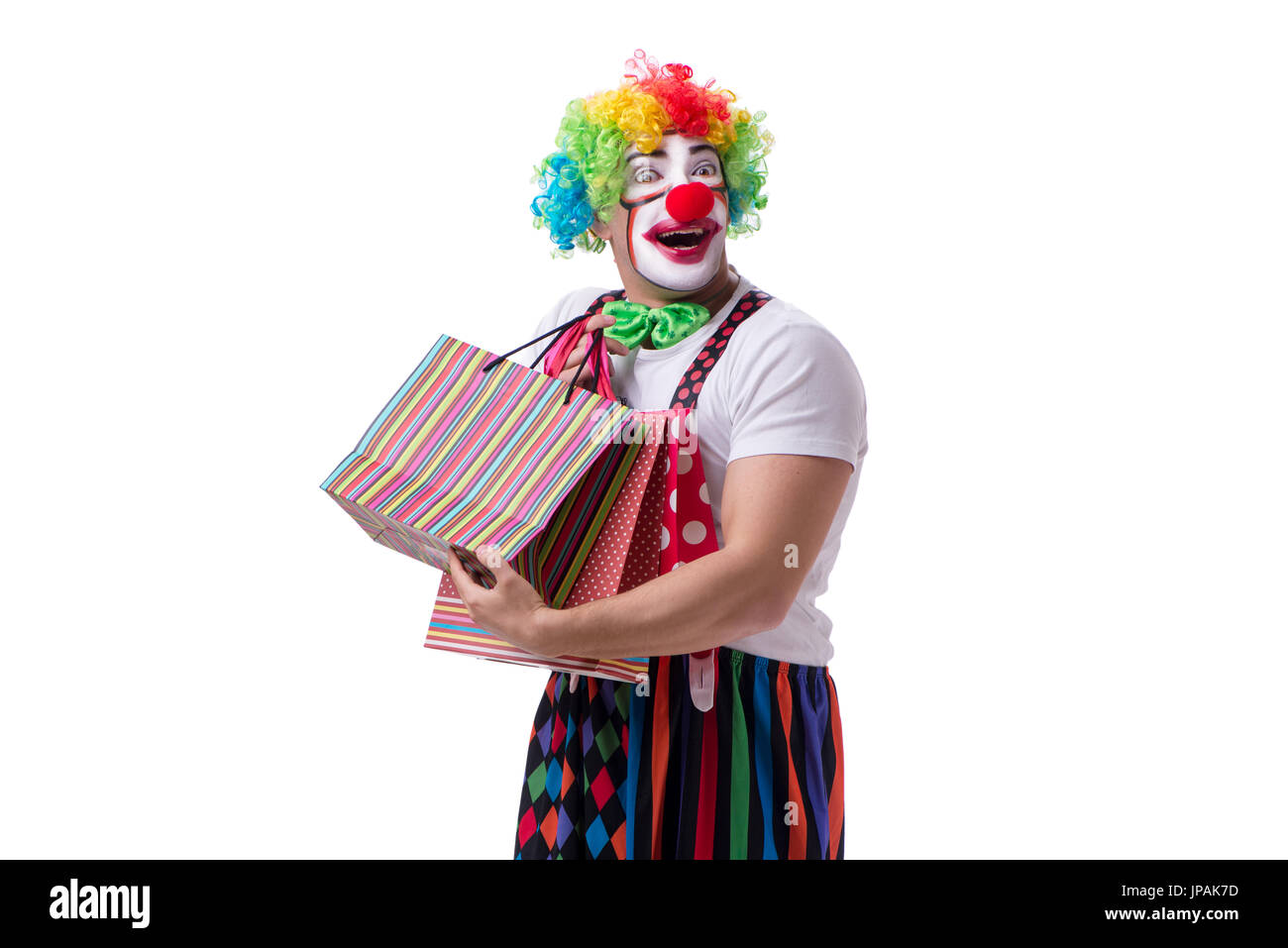 Funny clown with shopping bags isolated on white background Stock Photo ...