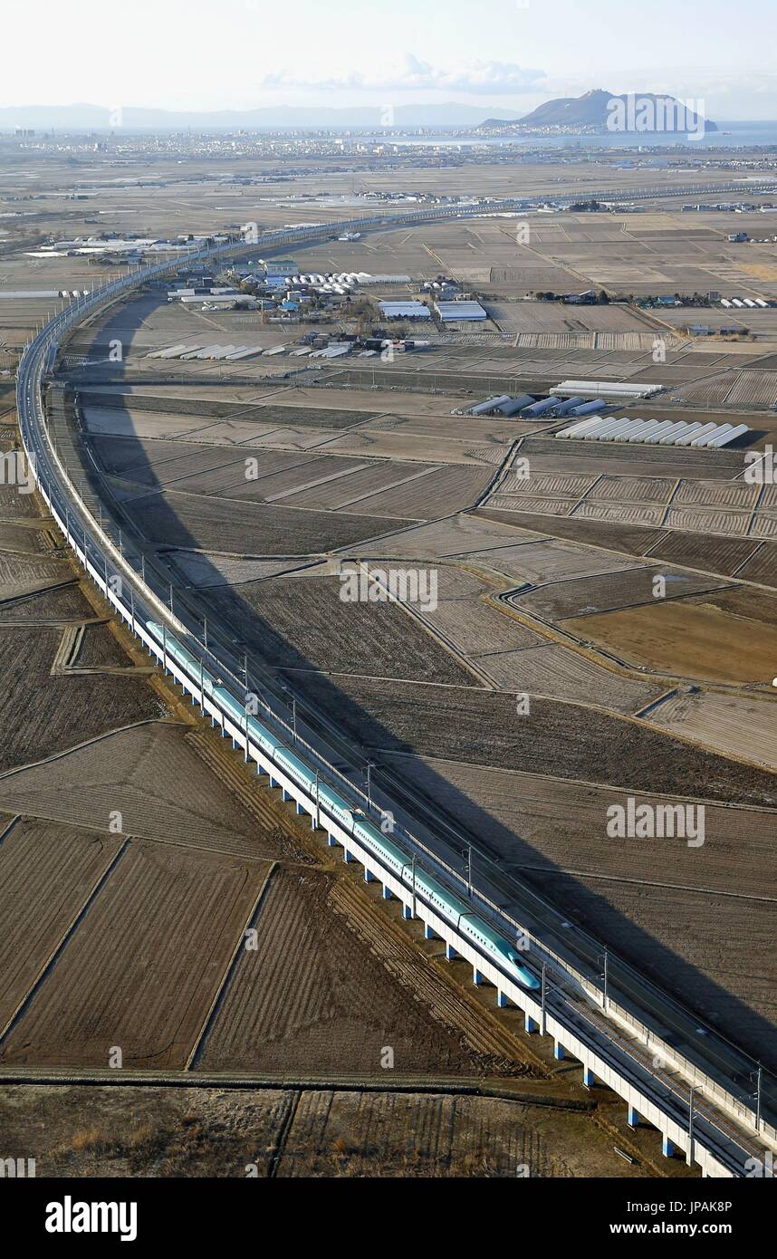 Photo taken from a Kyodo News helicopter shows the first shinkansen ...