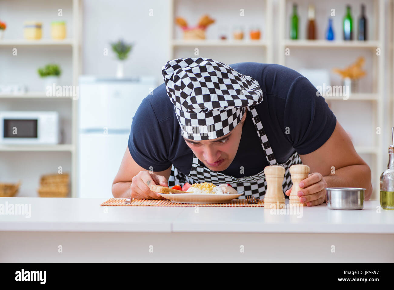 Chef cook cooking a meal breakfast dinner in the kitchen Stock Photo ...