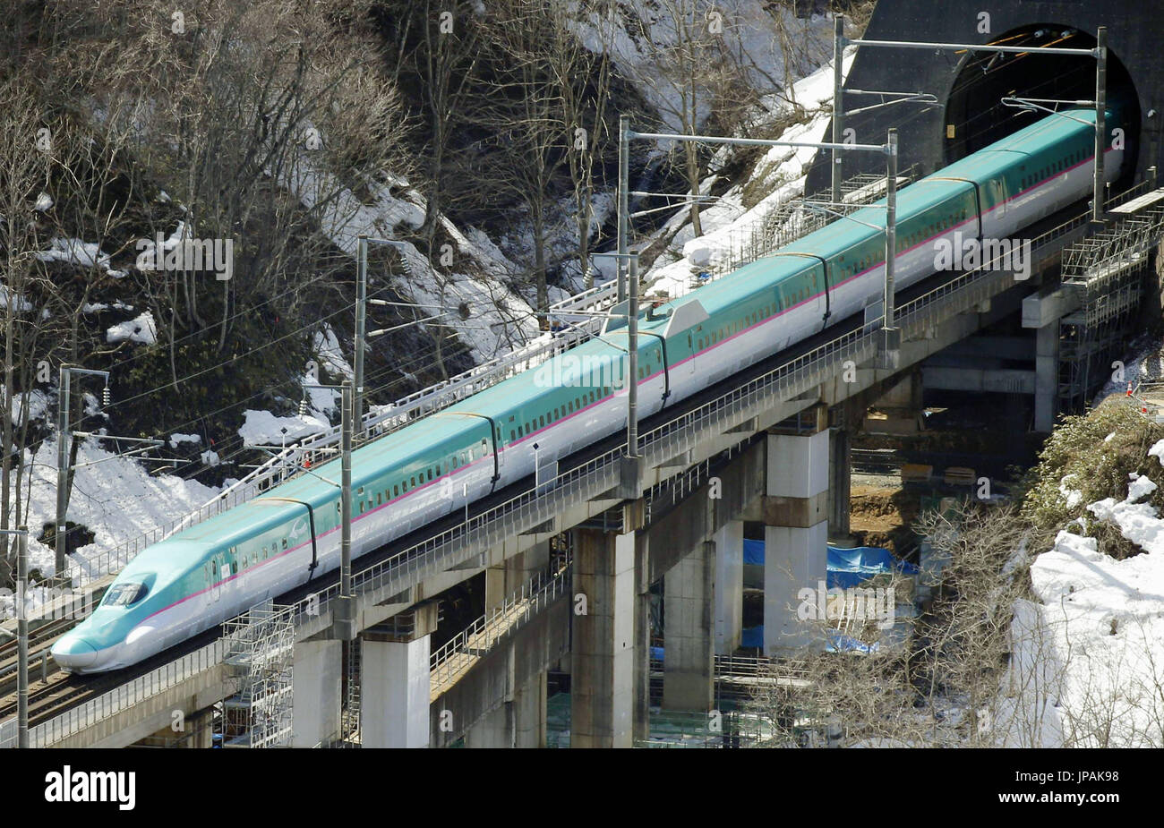 Photo taken from a Kyodo News helicopter shows the first shinkansen ...