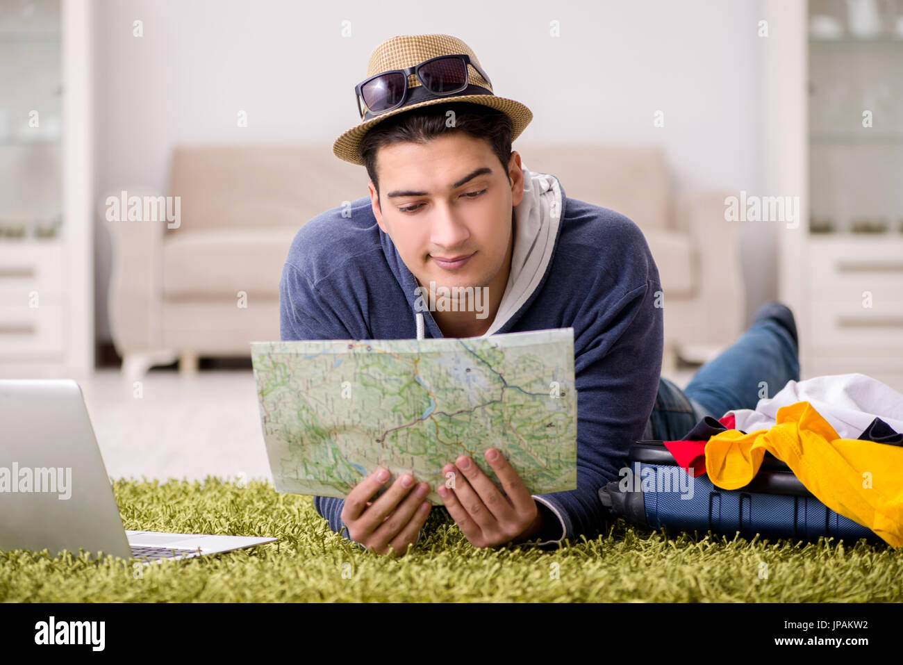 Man planning his vacation trip with map Stock Photo - Alamy
