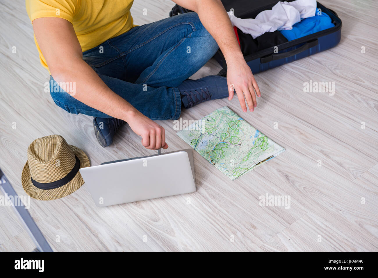 Man planning his vacation trip with map Stock Photo - Alamy
