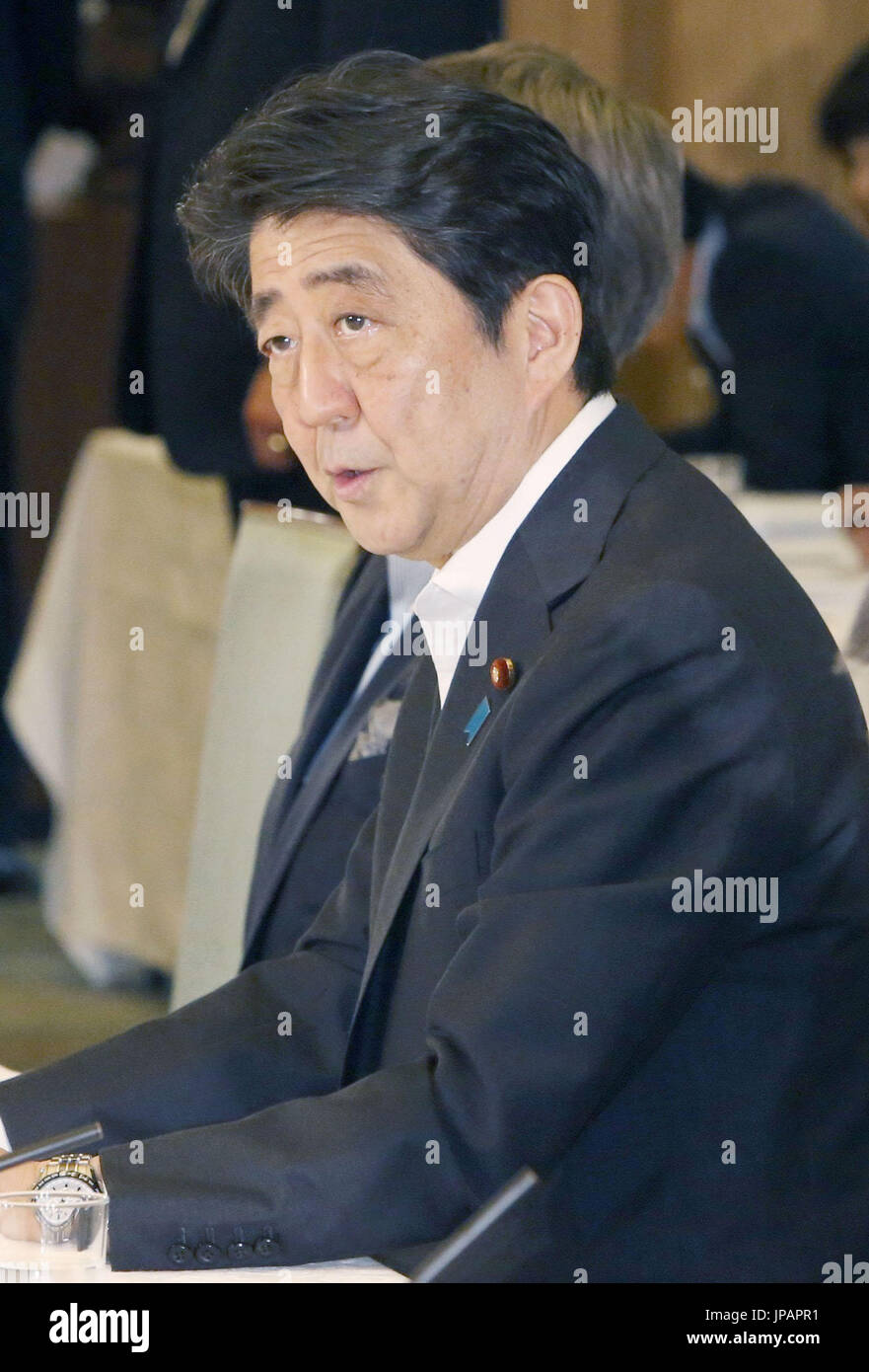 Prime Minister Shinzo Abe attends a meeting of the government and the ...